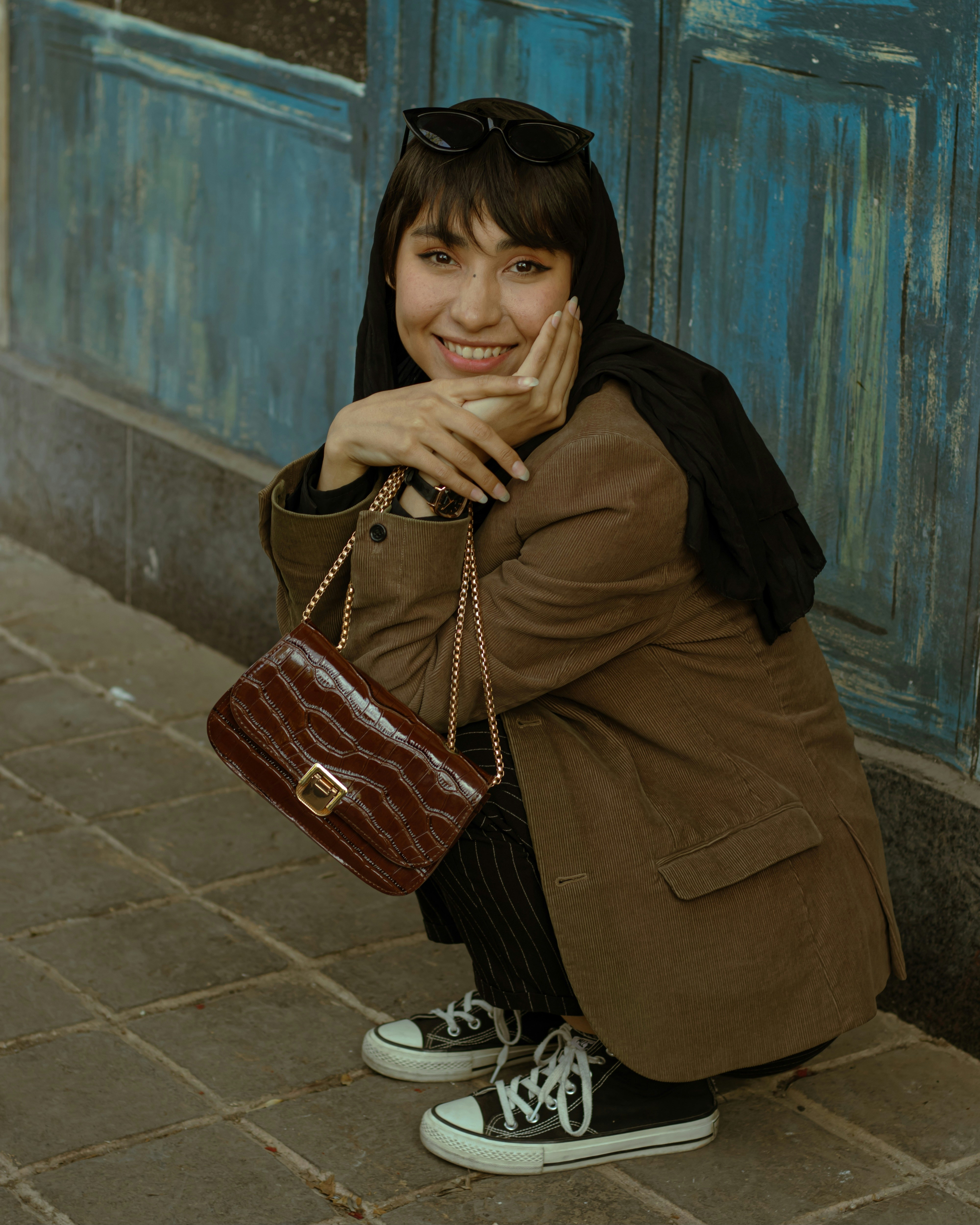 Casual Charm at the Blue Door: A City Portrait in Brown and Brass