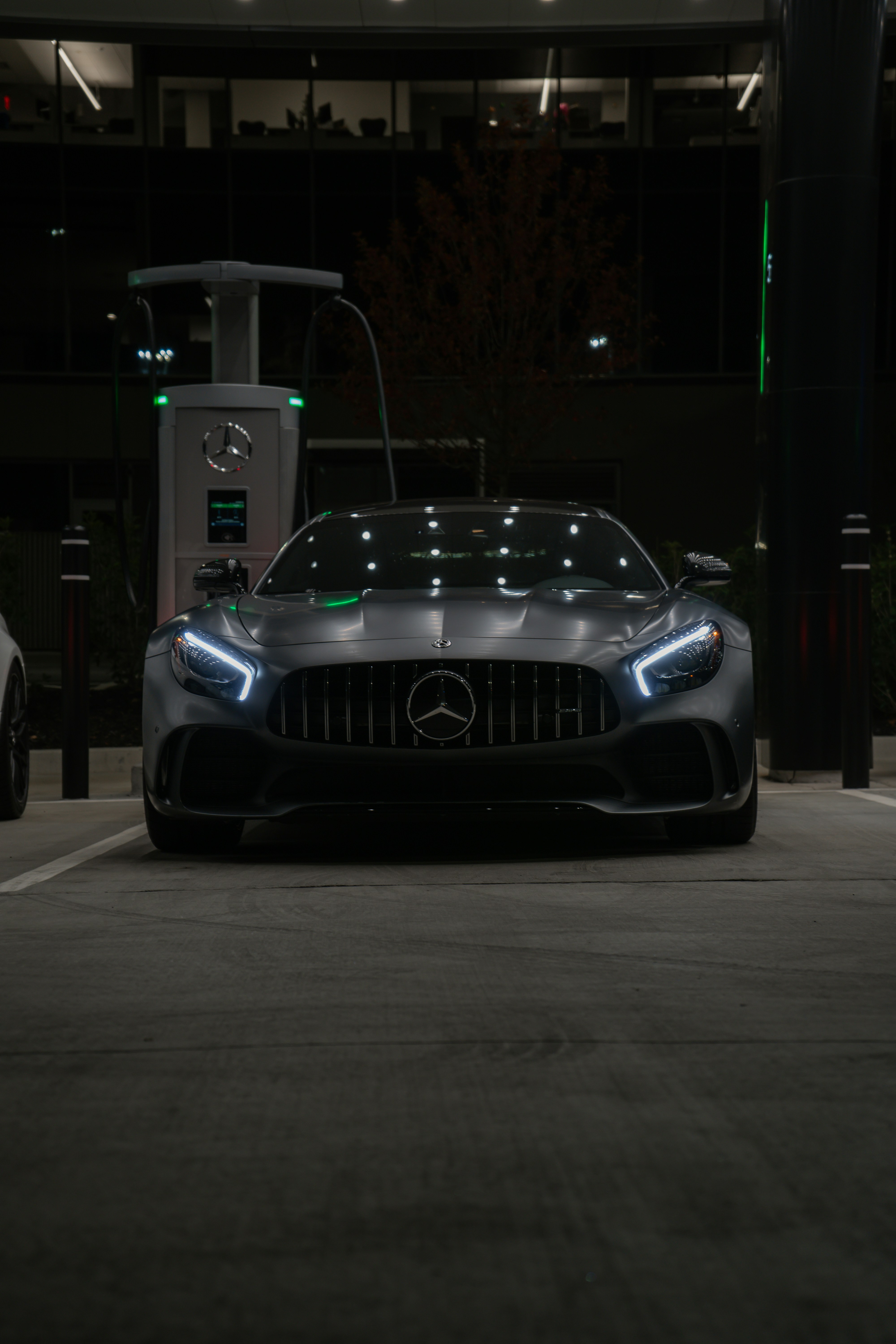 Nocturnal Mercedes-Benz AMG at a Neon-Charged EV Charger