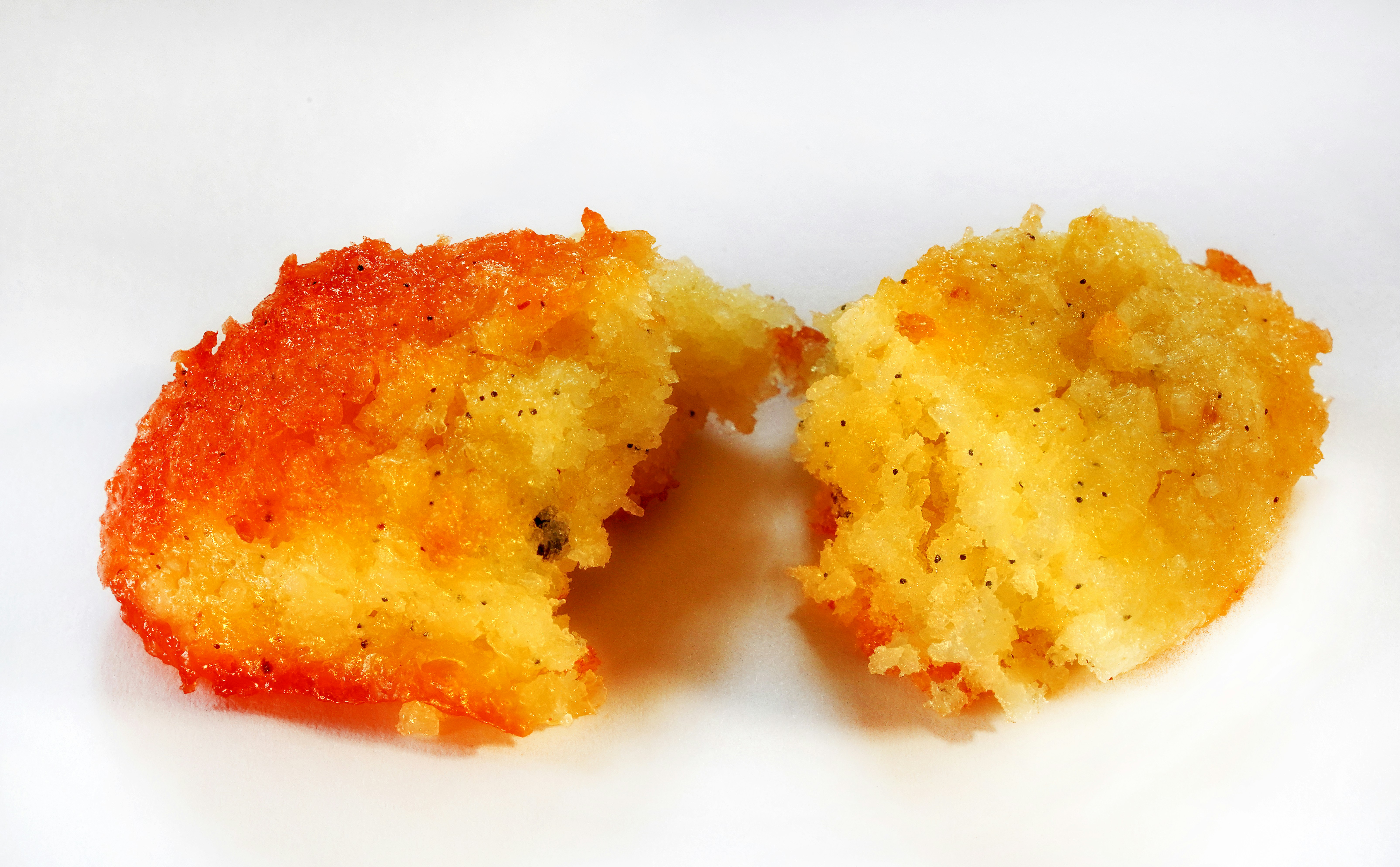Sugared Crisp Duo: Twin Golden Pastry Halves on a White Stage