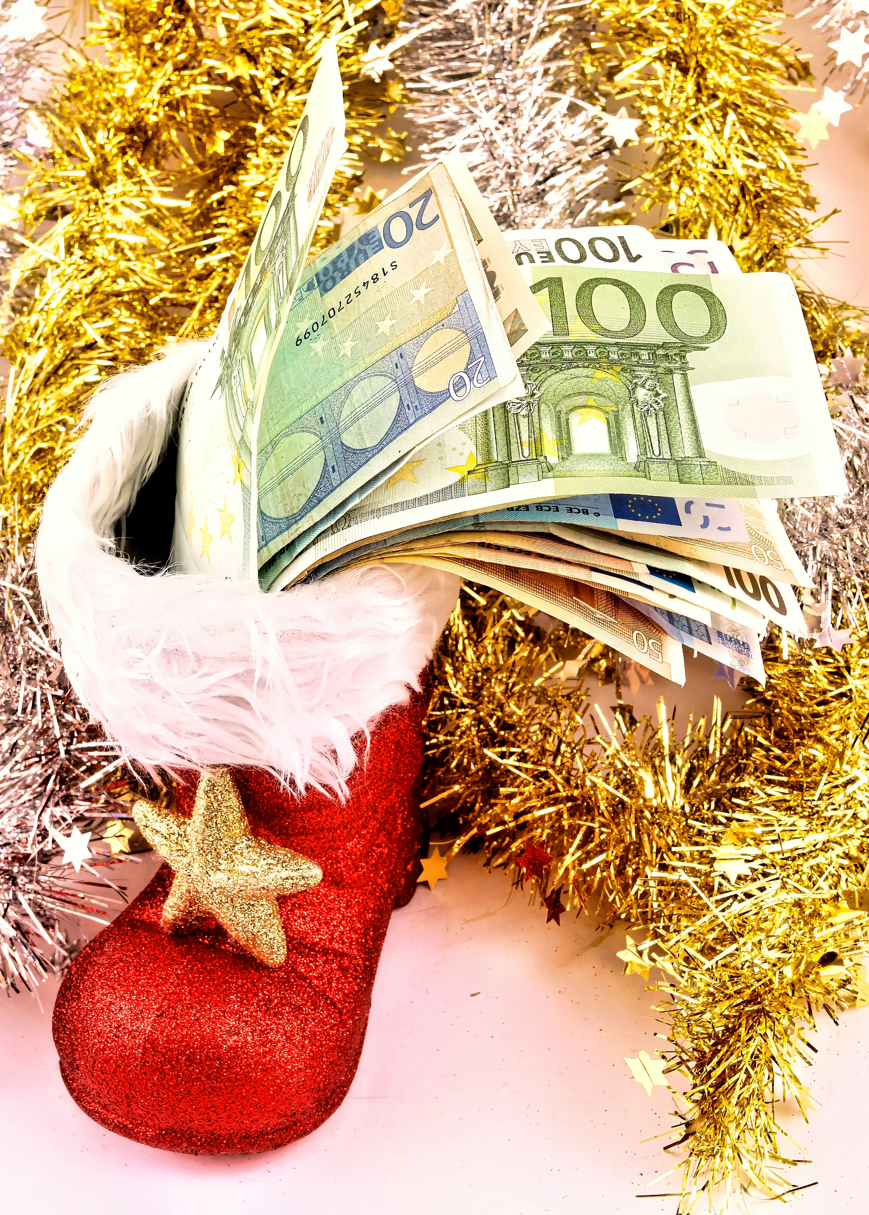 A christmas stocking with money sticking out of it photo – Free ...