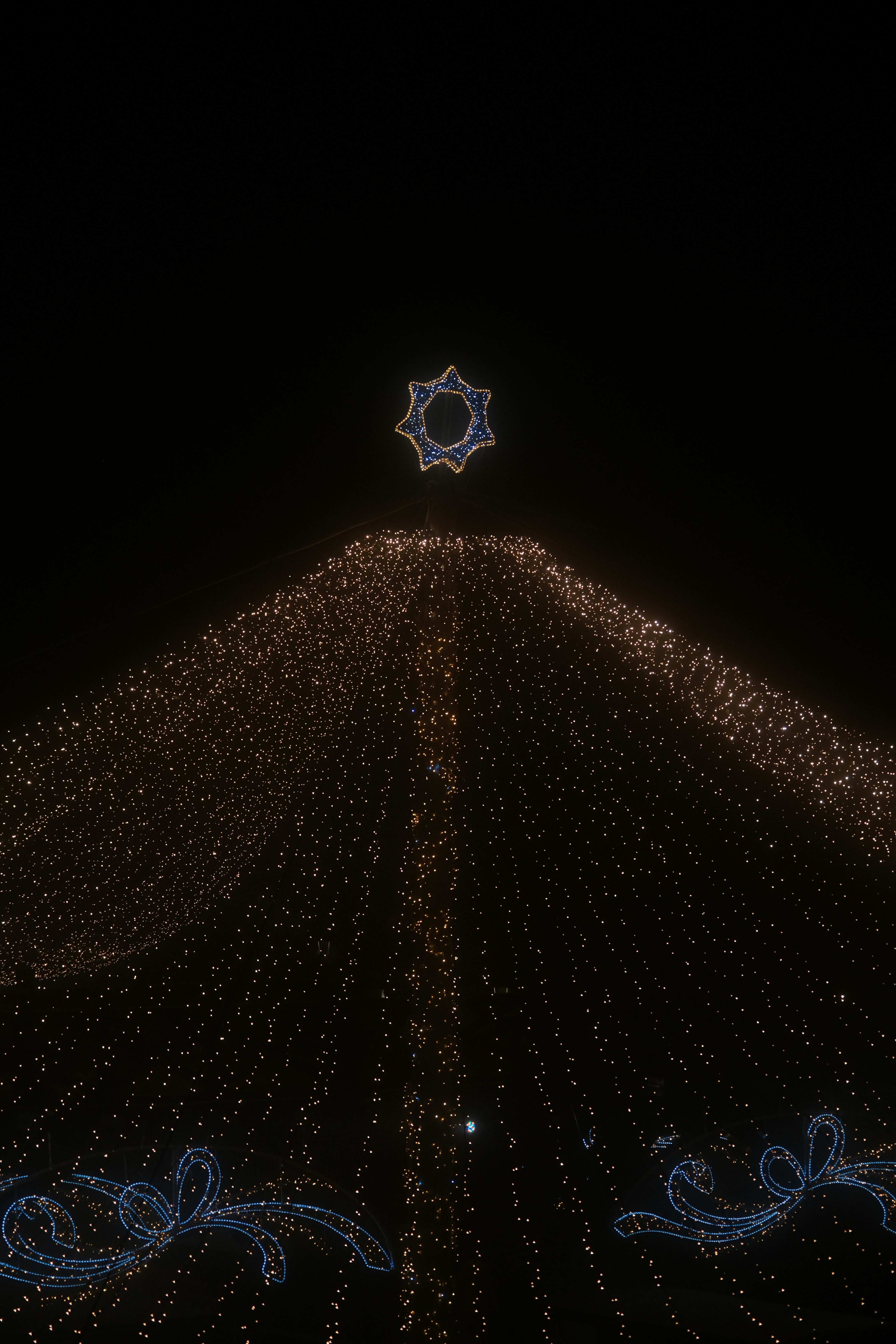Star Crown Above a Conical Sea of Lights