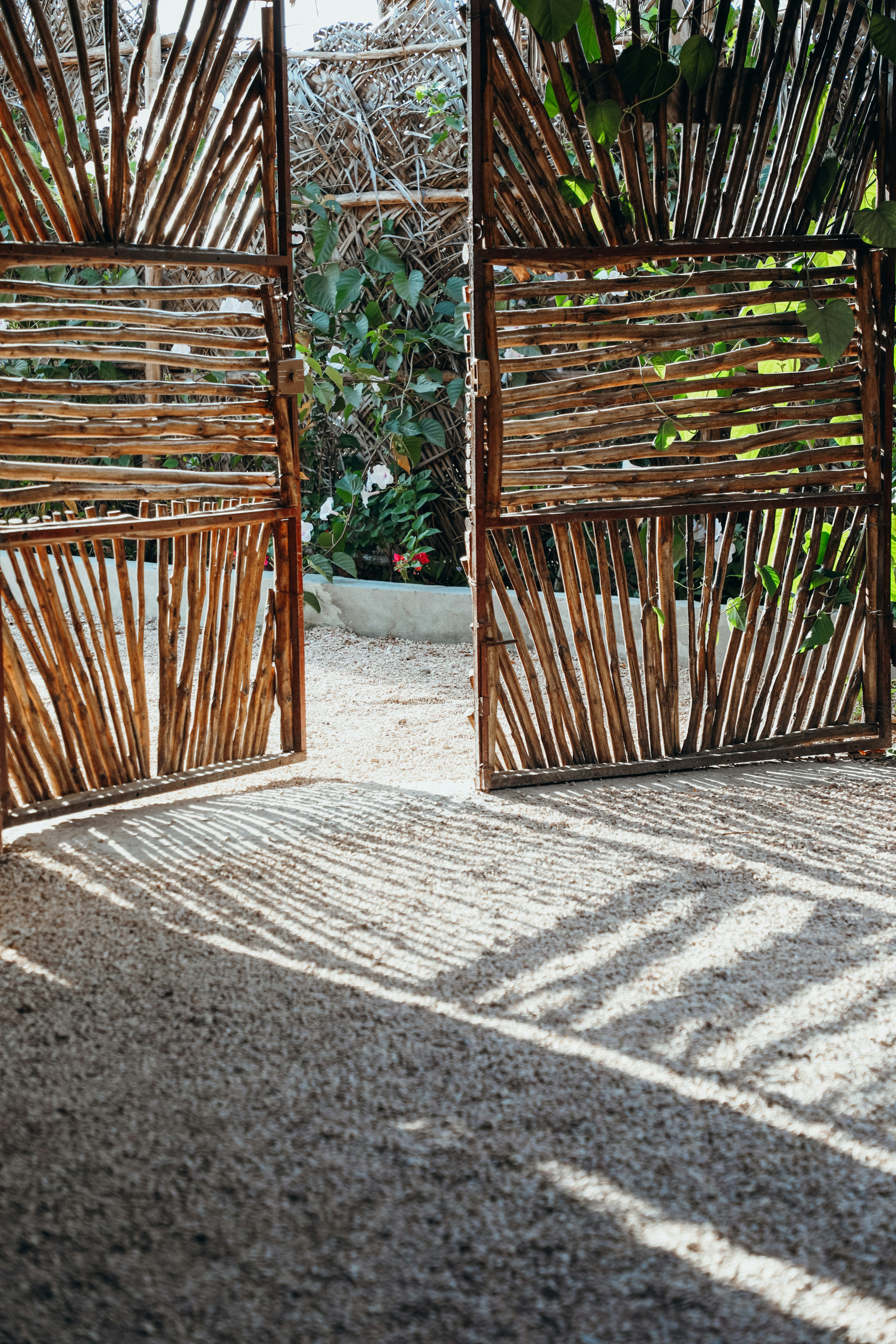 A couple of wooden gates sitting next to each other