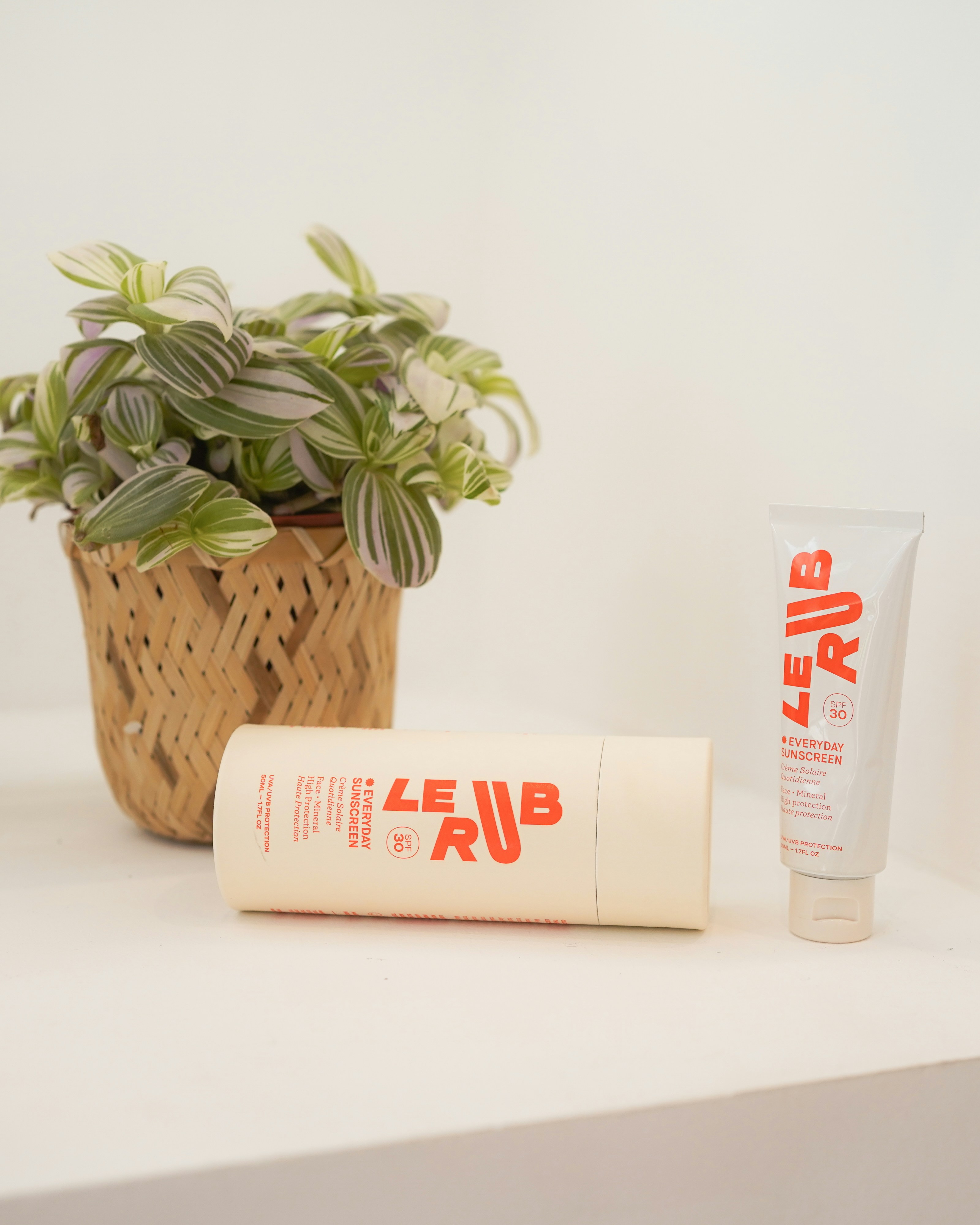 A white table with a plant and a tube of lip balm photo – Free Wellness ...