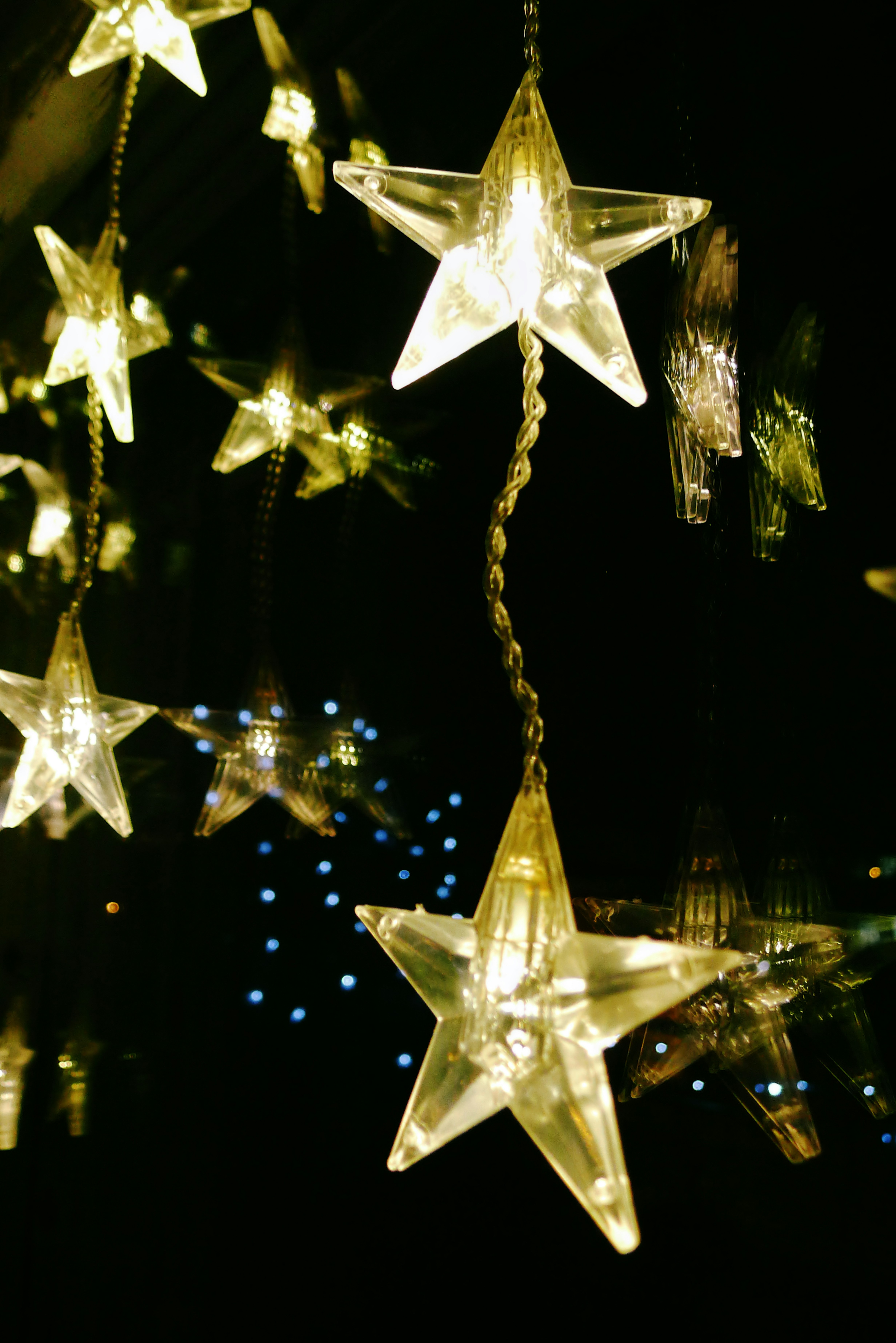 A string of star lights hanging from a ceiling photo – Free Erlangen ...