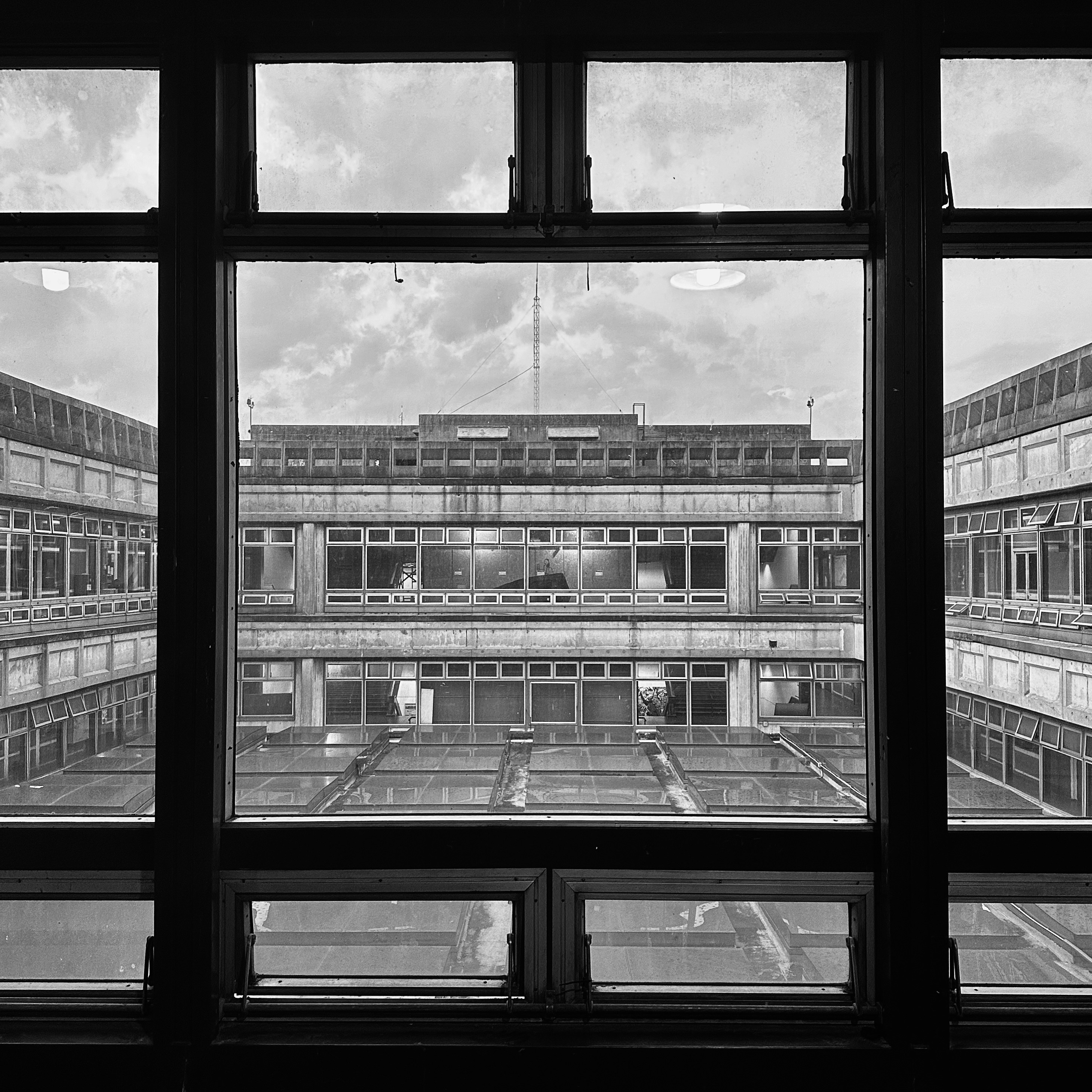 Symmetry Across Glass: An Institutional Atrium Framed by Windows