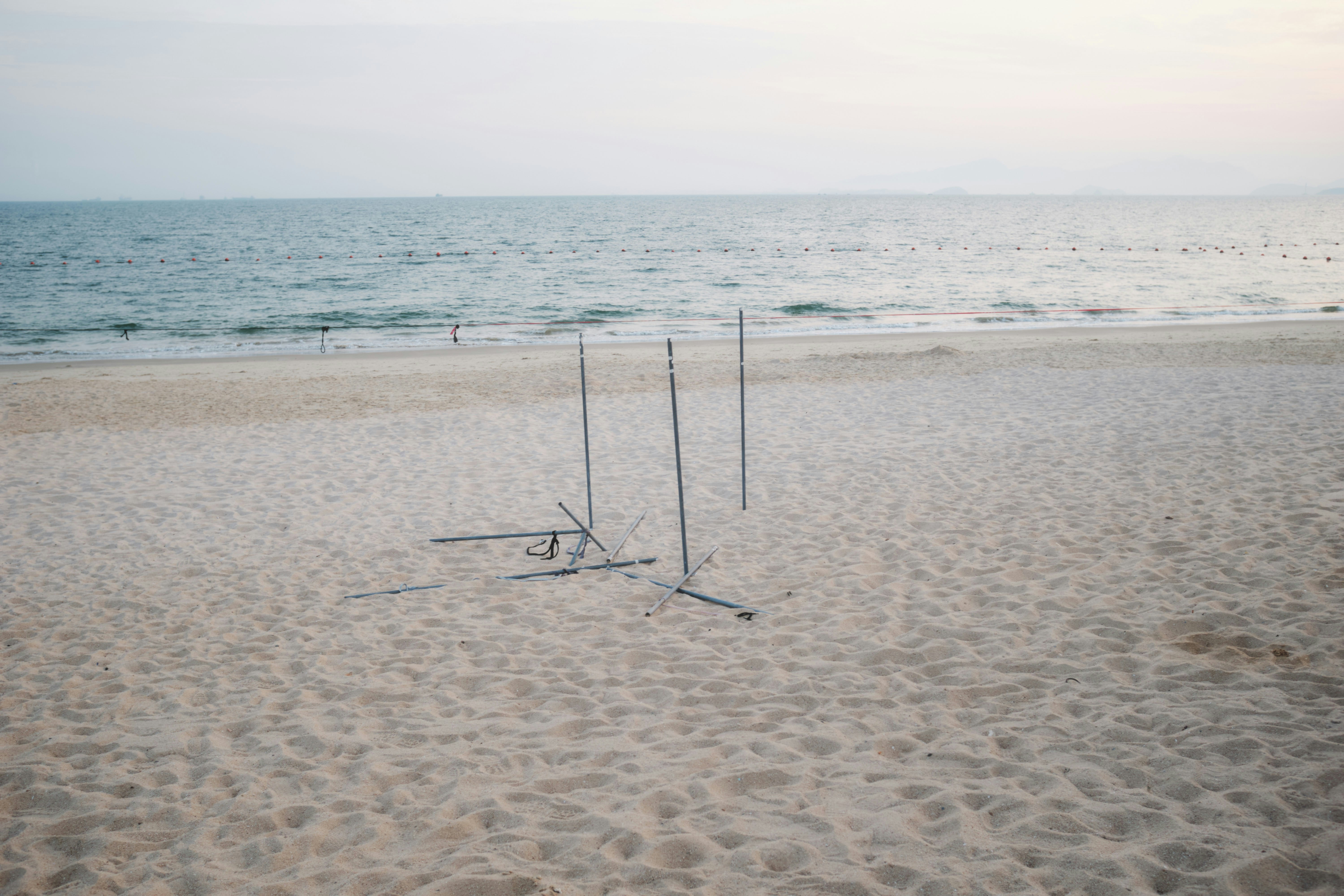 Three Vertical Poles on a Quiet Beach: Geometry in Sand
