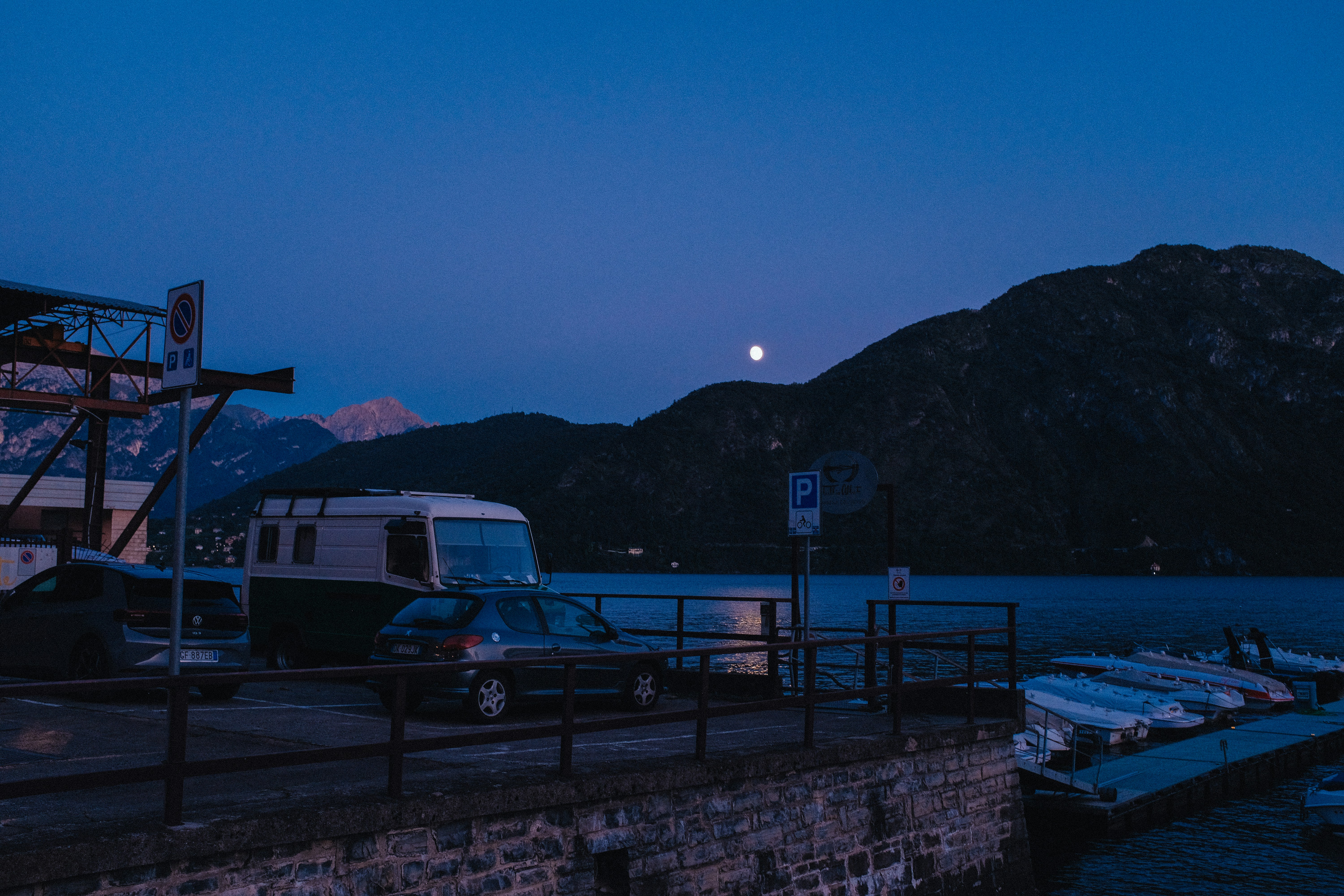 Moonrise Over the Harbor: Quiet Evening by the Docks