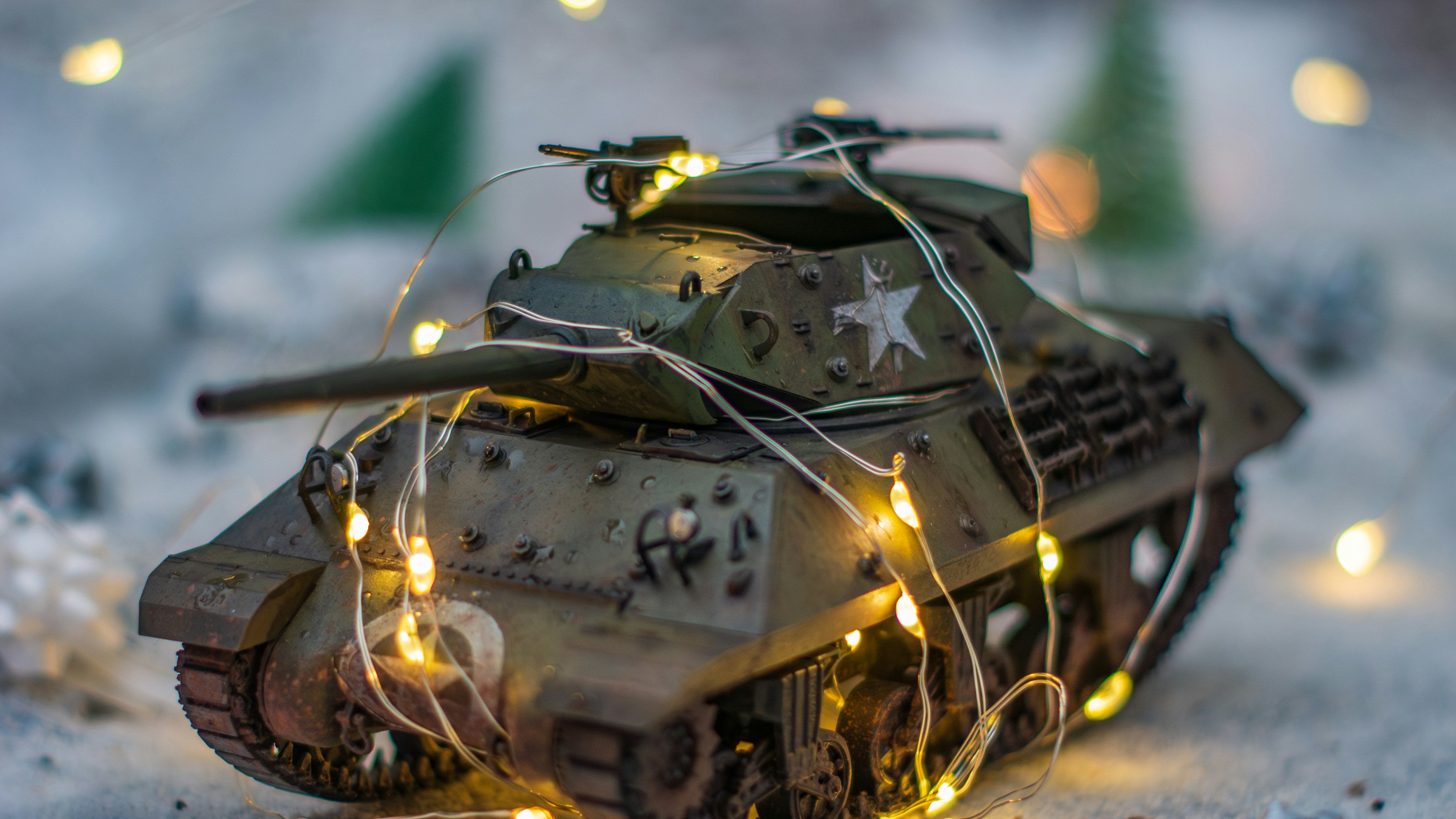 Miniature Tank on a Snowy Diorama Wrapped in Fairy Lights