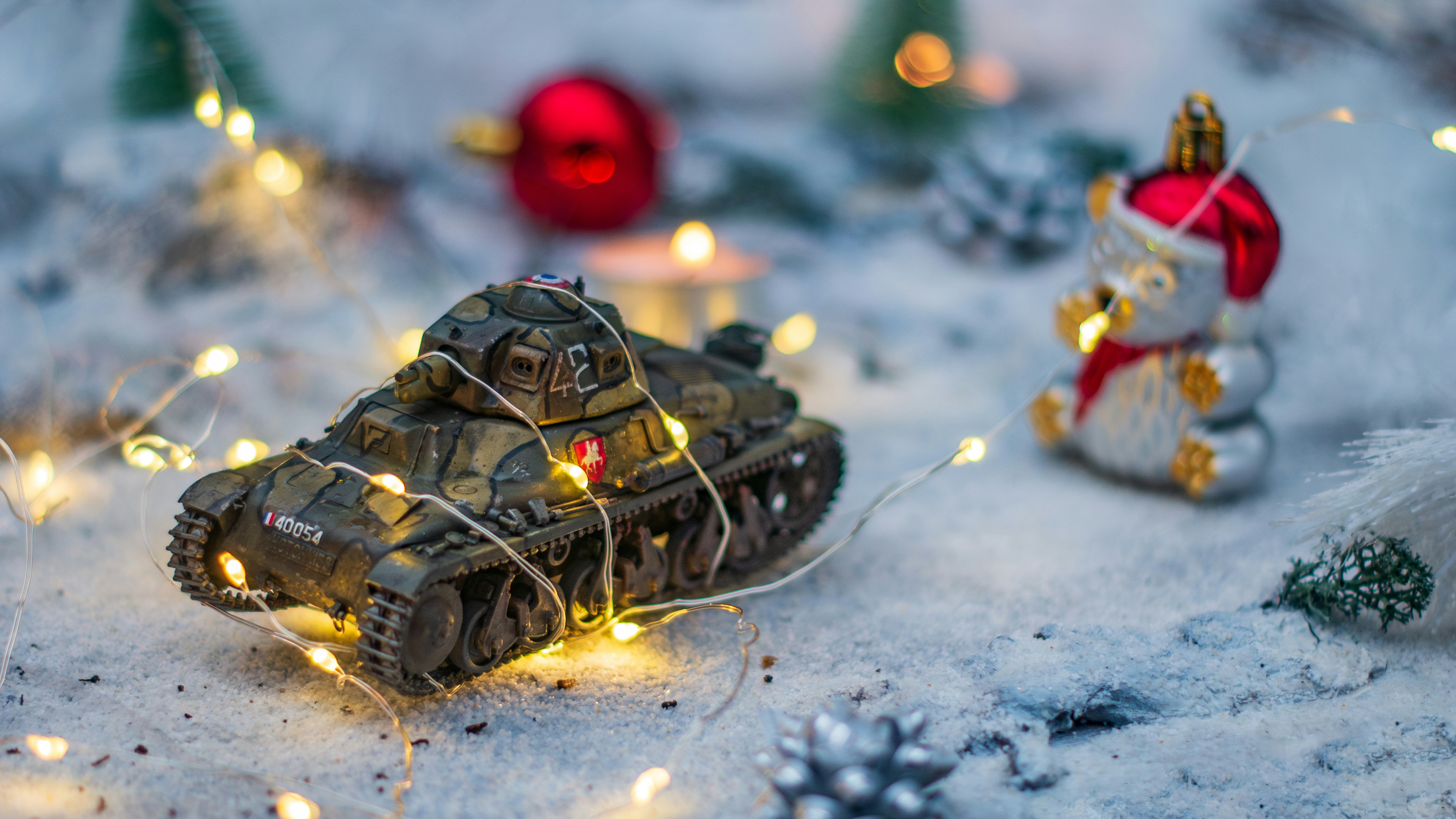 A toy tank with lights on it sitting in the snow photo – Free Military ...
