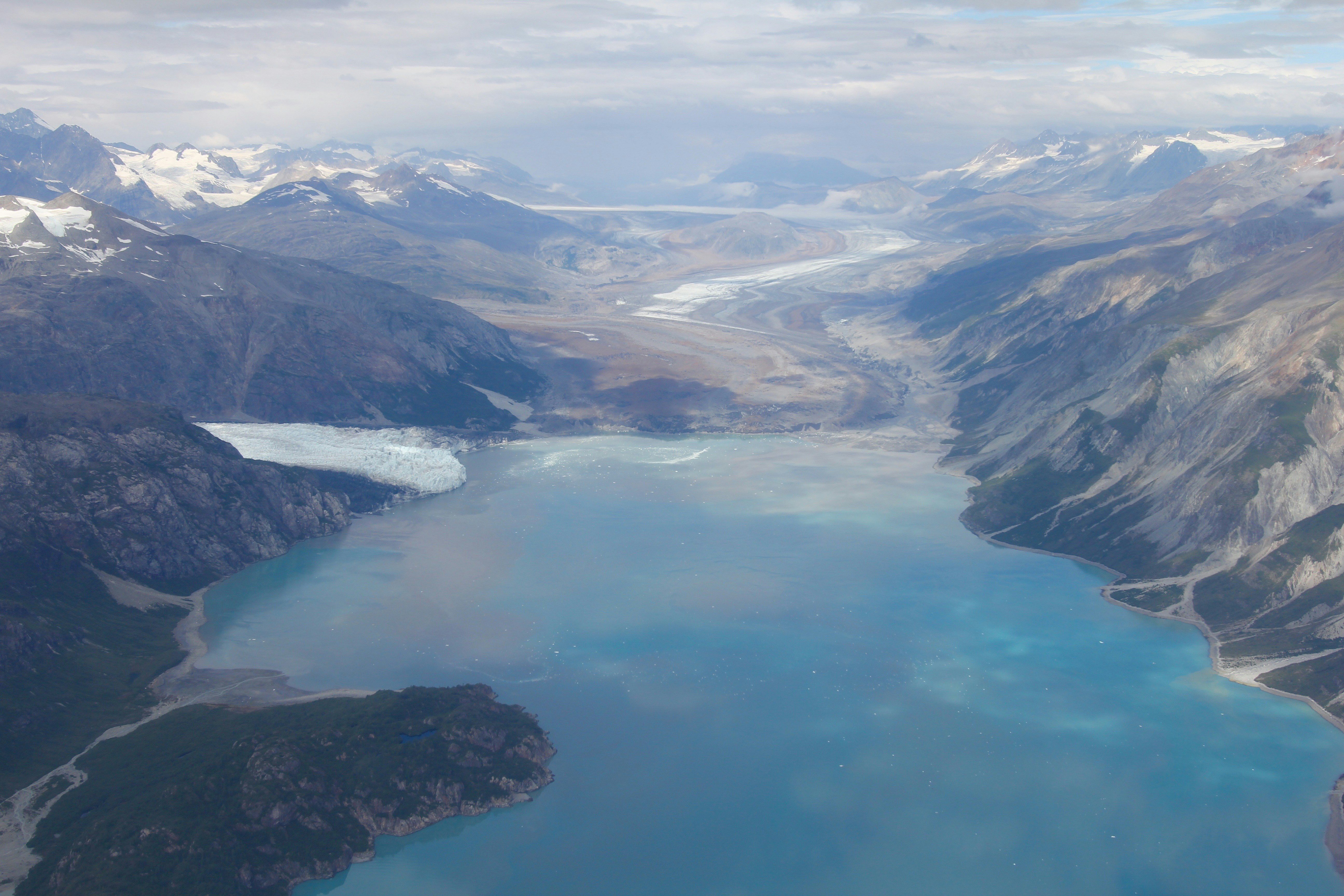 Turquoise Fjord Overlook: Aerial Vista Through Glacial Valleys