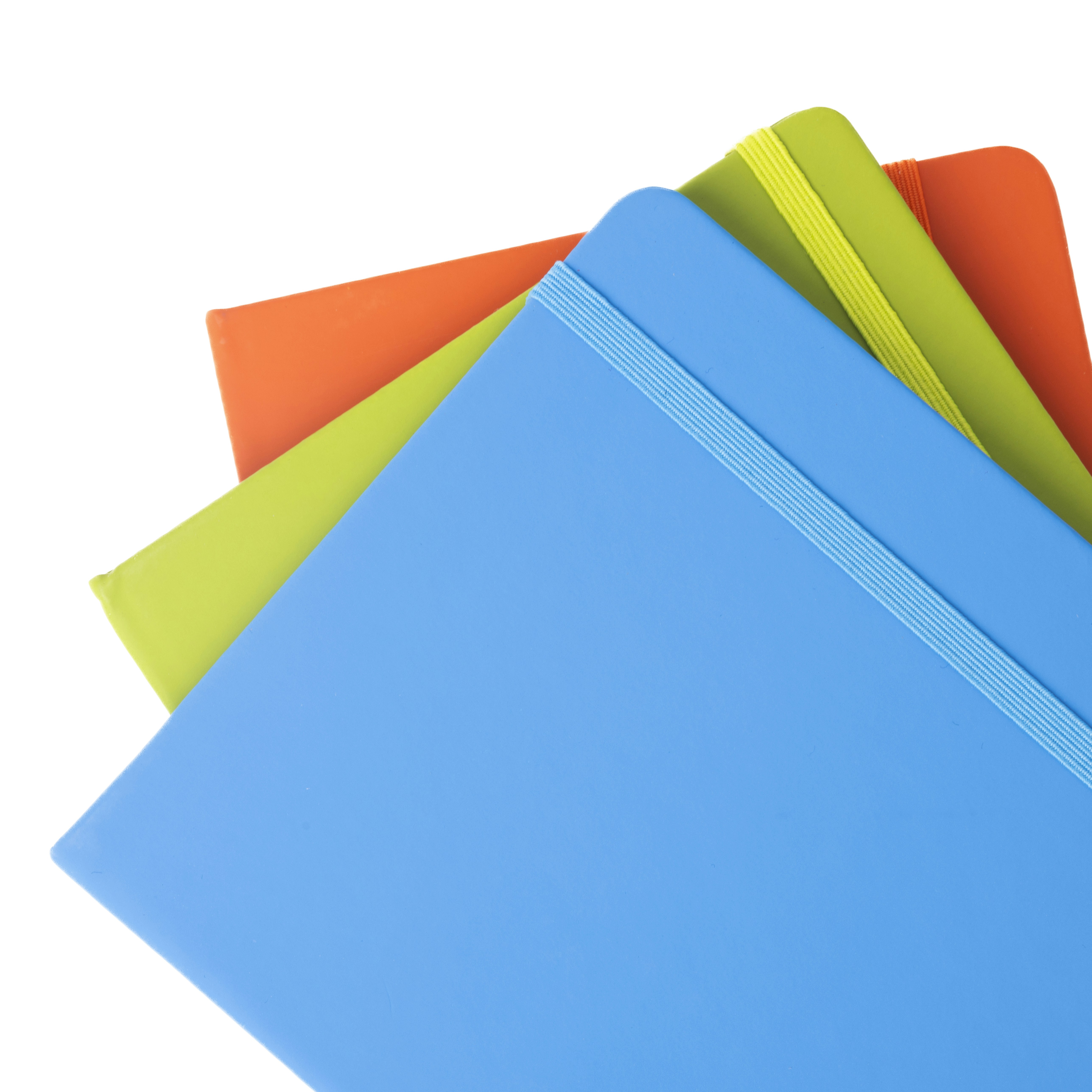 A stack of different colored folders on a white background photo – Free ...