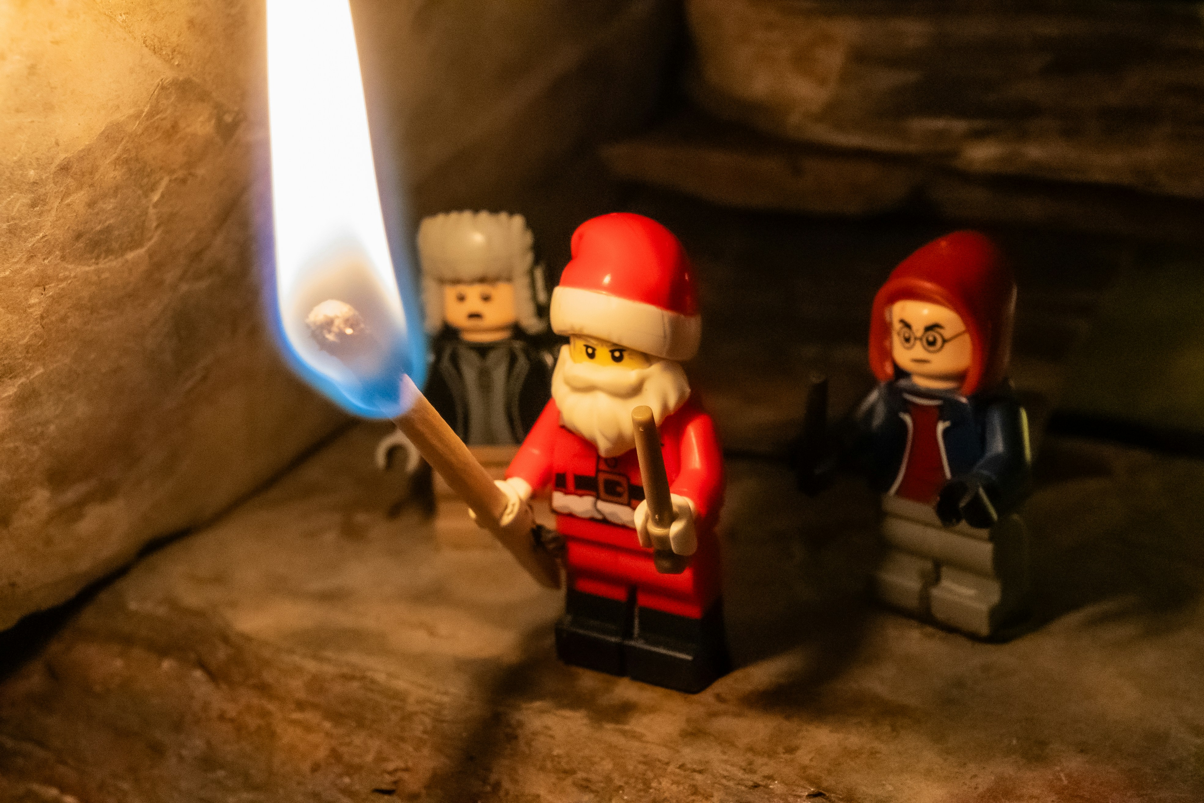 Lego Santa in a Candlelit Cave: a Tiny Firelight Standoff