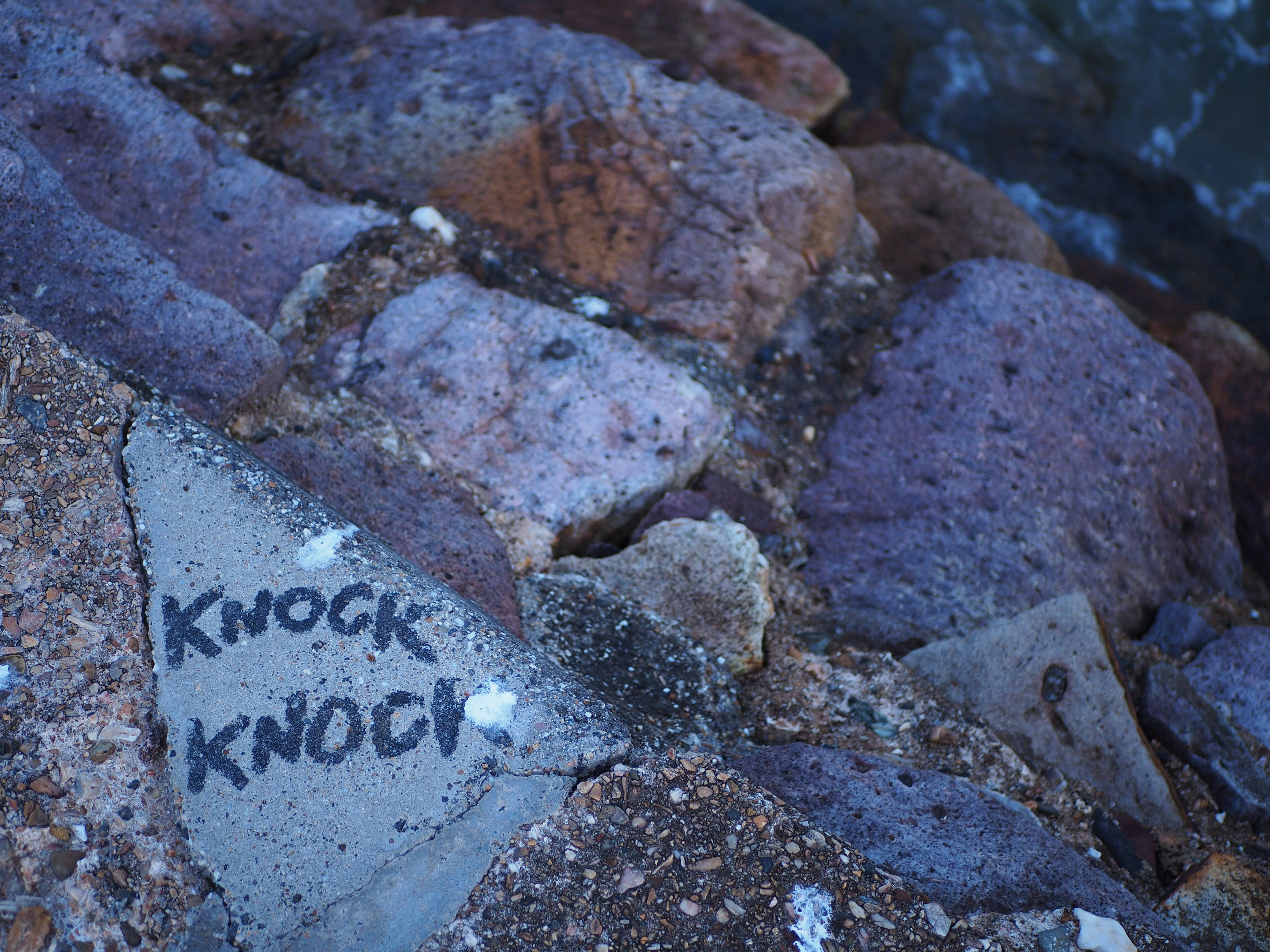 A close up of rocks with writing on them photo – Free Road Image on ...