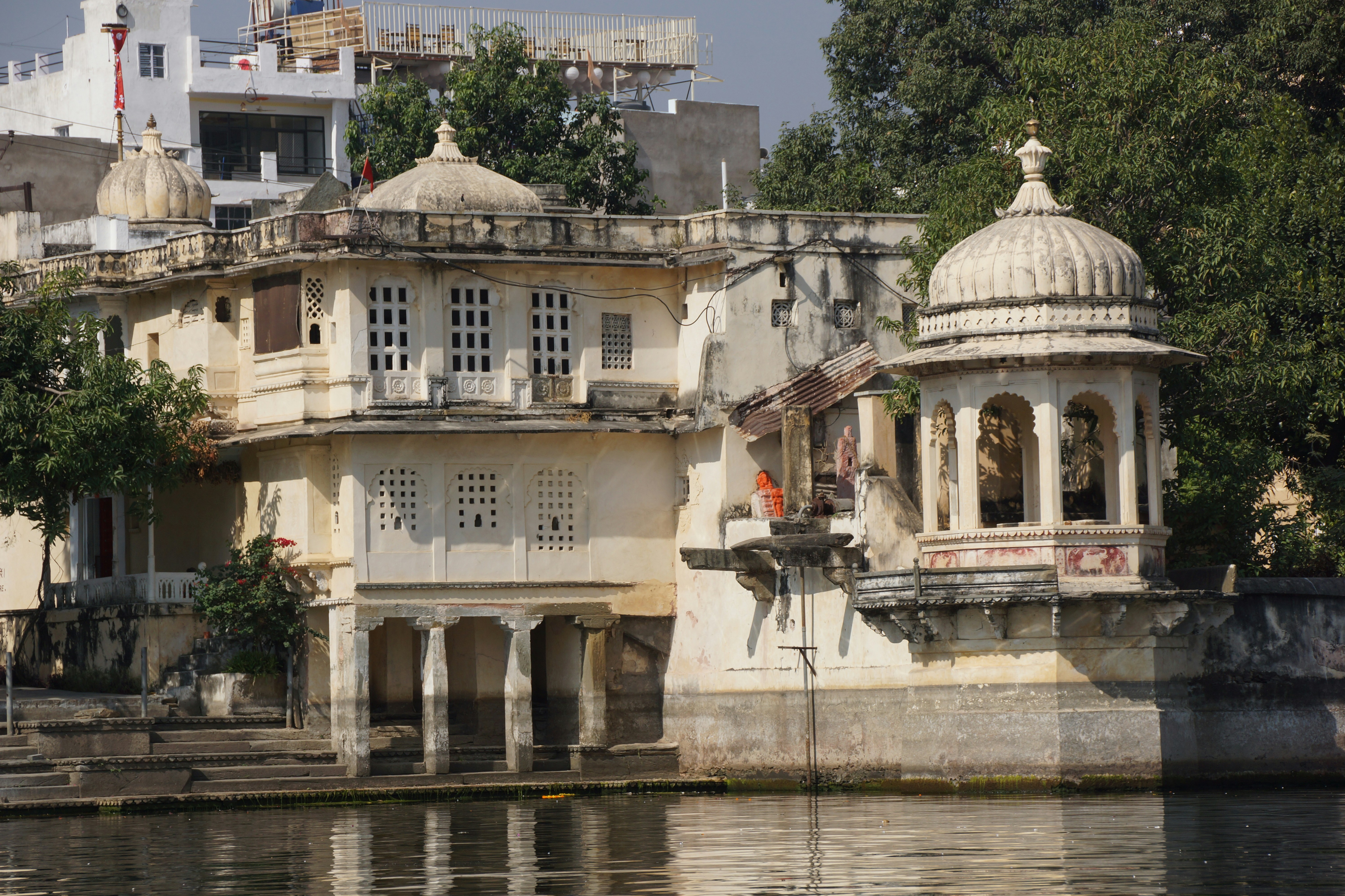 Riverside Dome and Arcades: Sunlit White Pavilion Framing Quiet Waters
