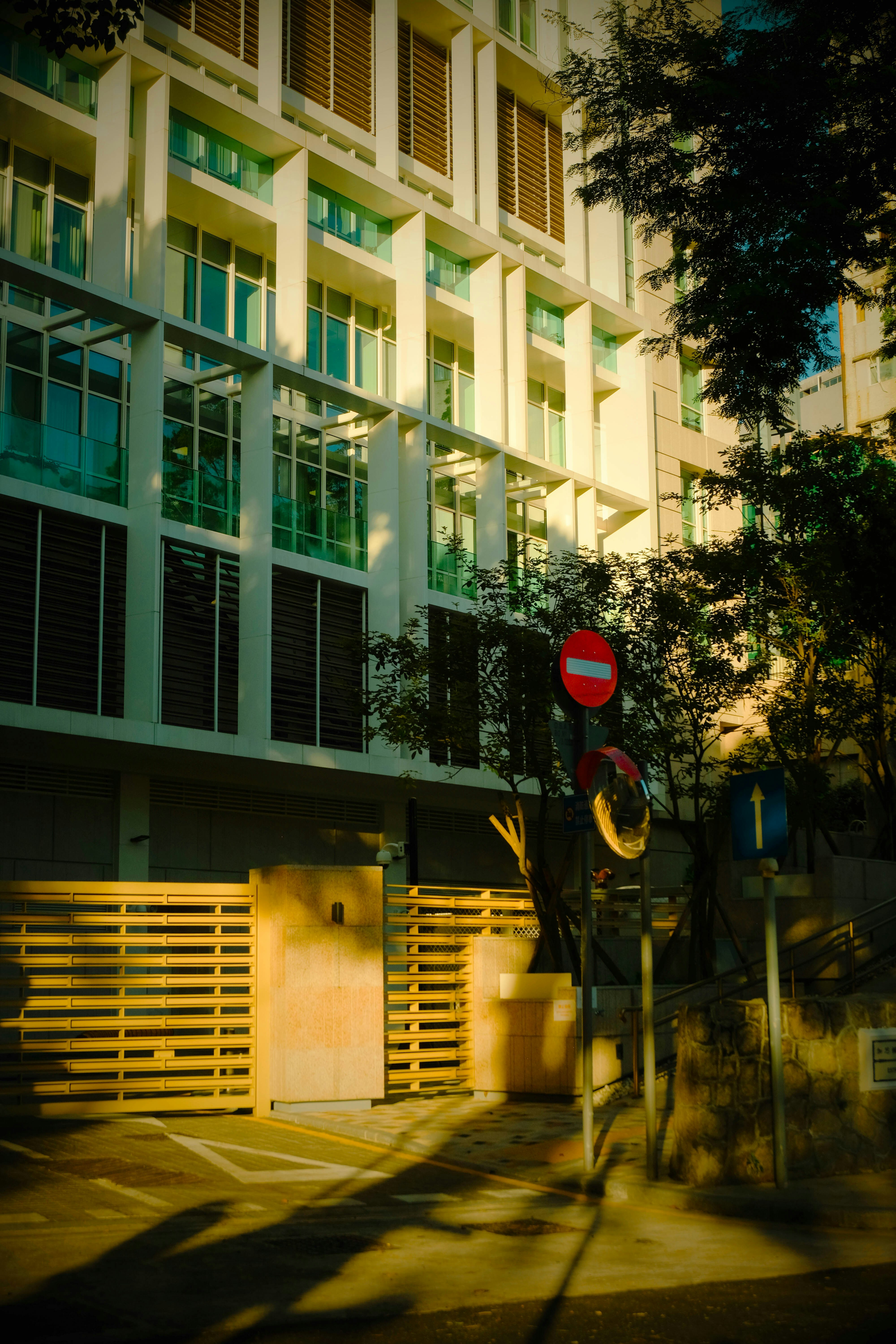 A stop sign in front of a tall building photo – Free Building Image on ...