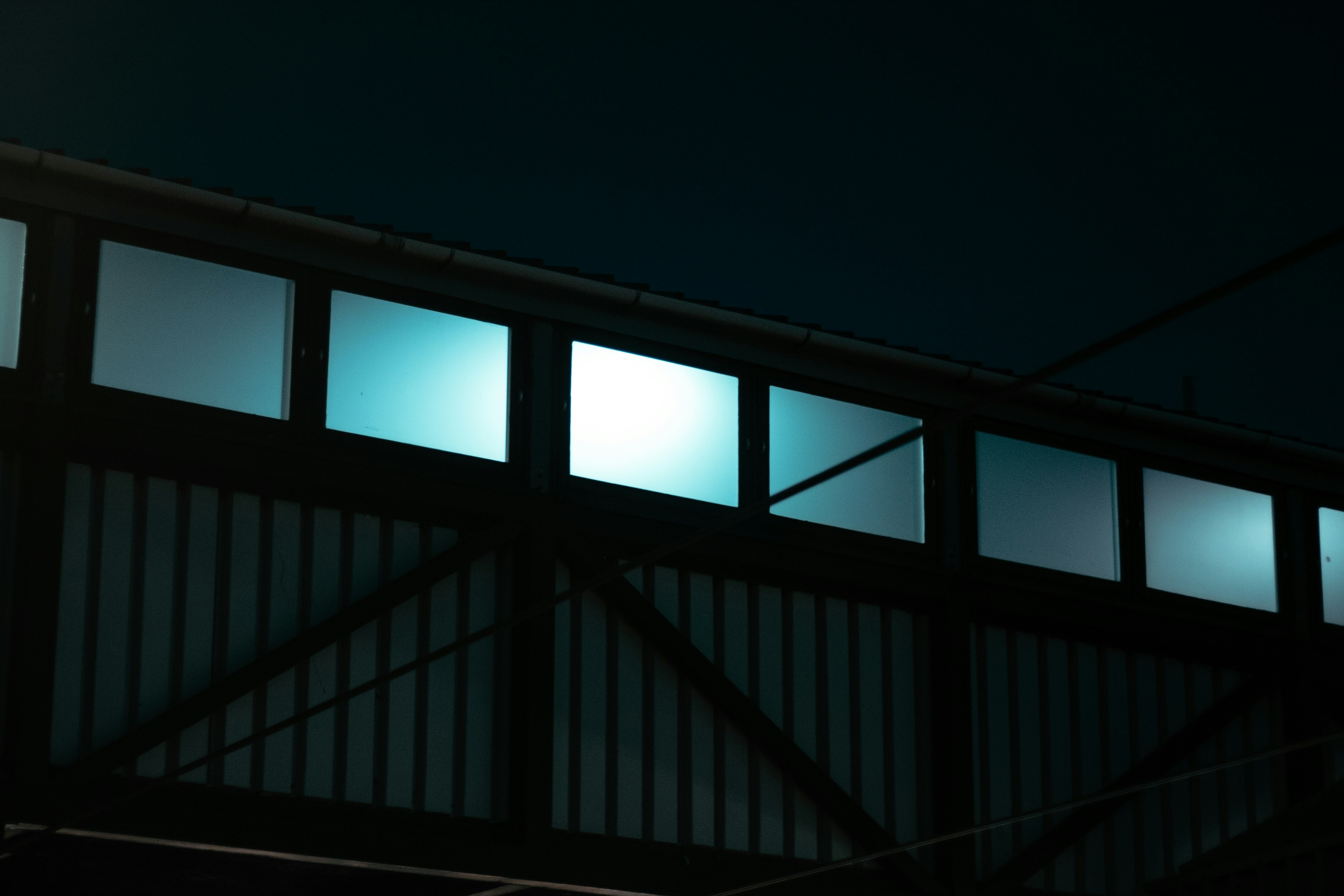 A stop sign is lit up at night photo – Free Building Image on Unsplash