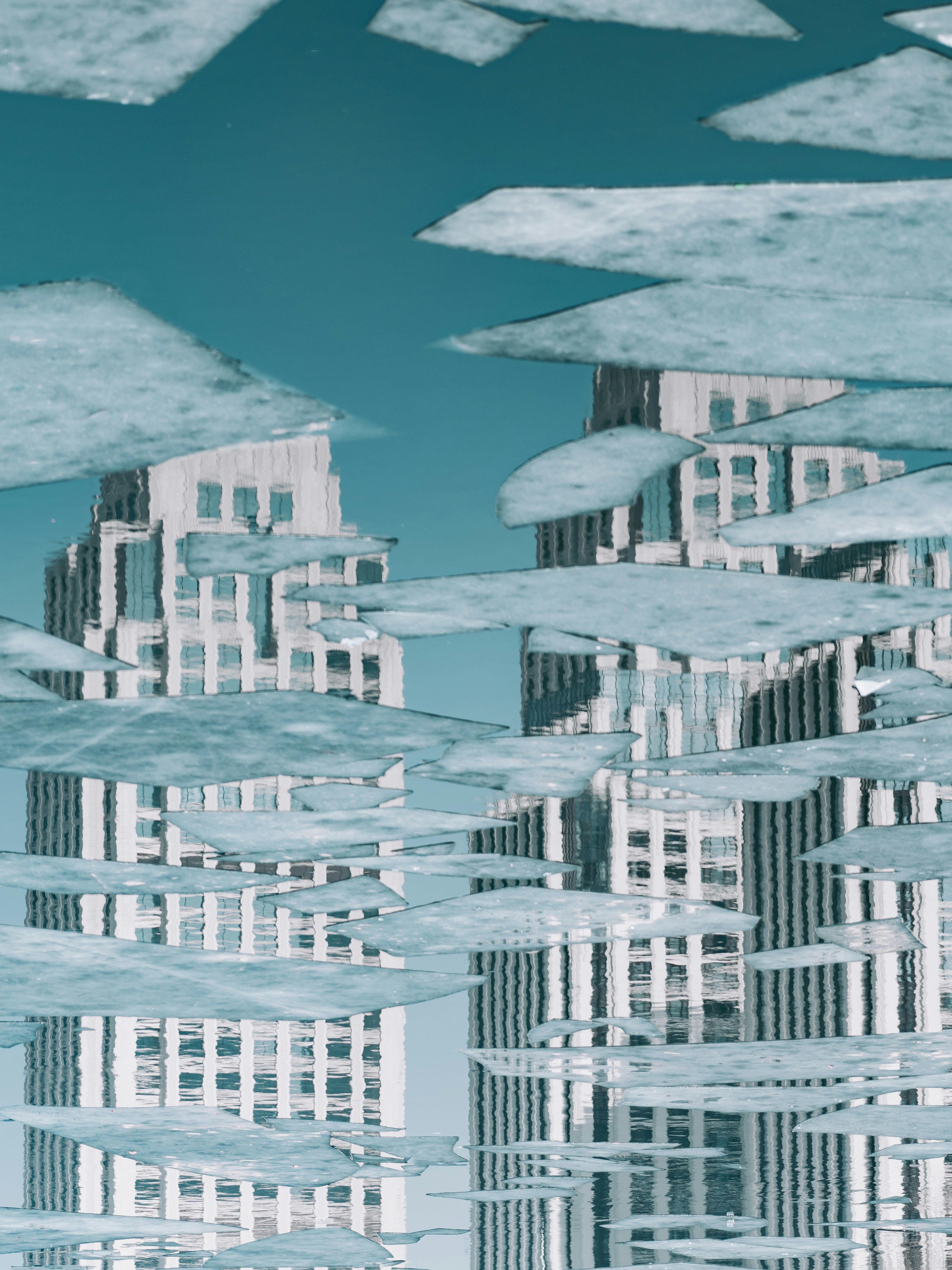 A reflection of buildings in the water photo – Free Architecture Image ...