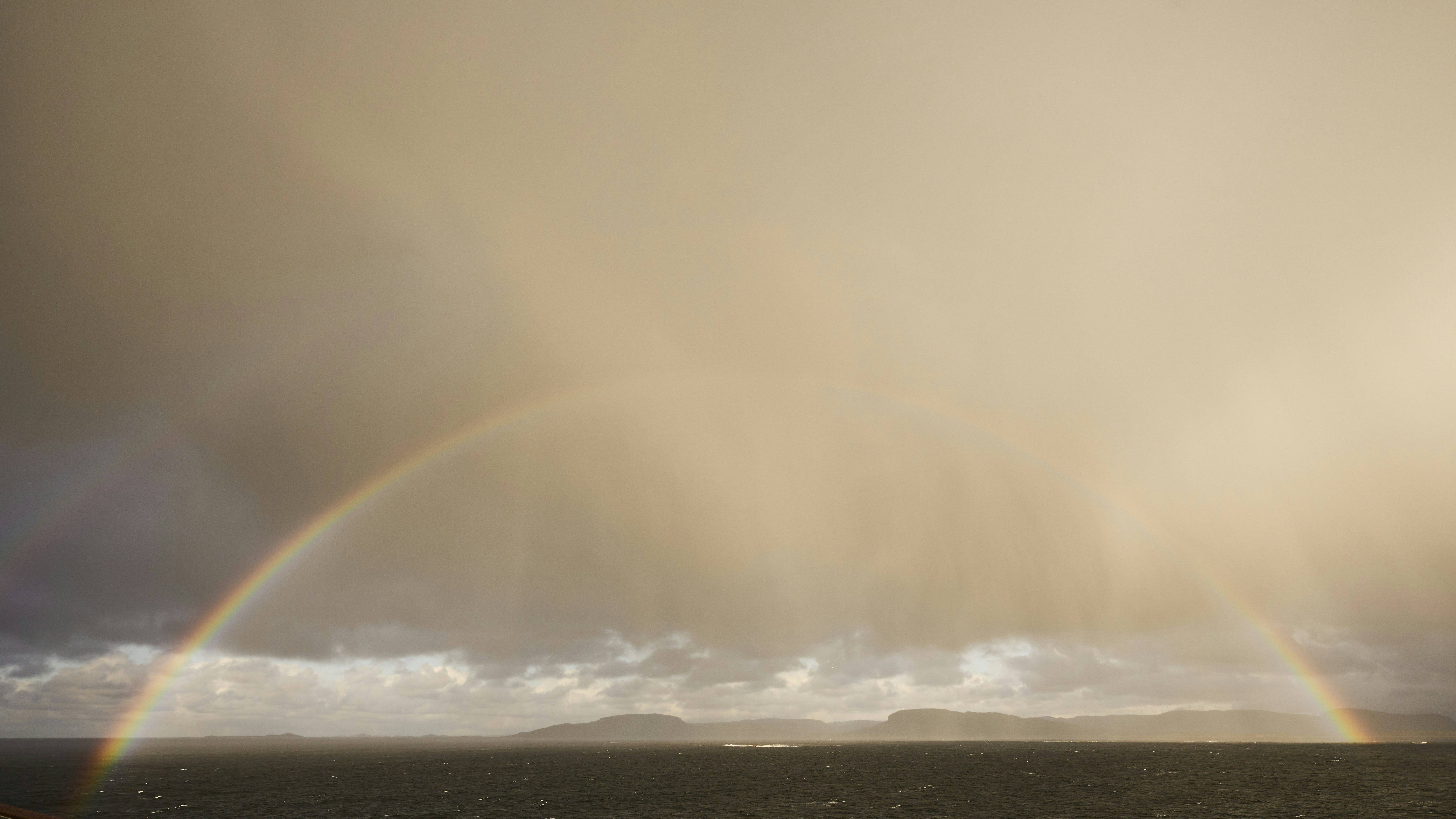 A double rainbow is seen in the distance photo – Free Scenery Image on ...