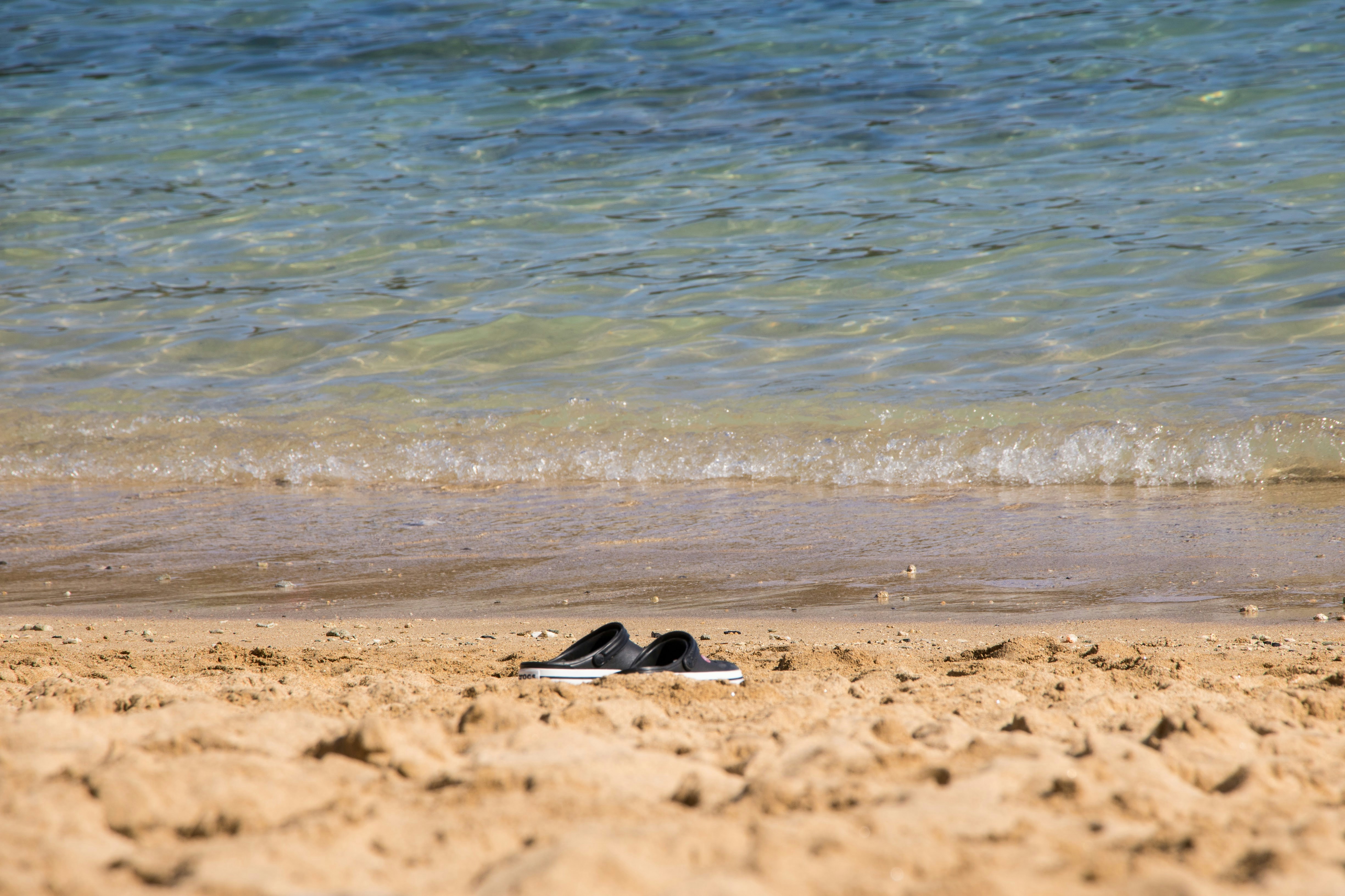 Solitary Shoes on a Quiet Shore