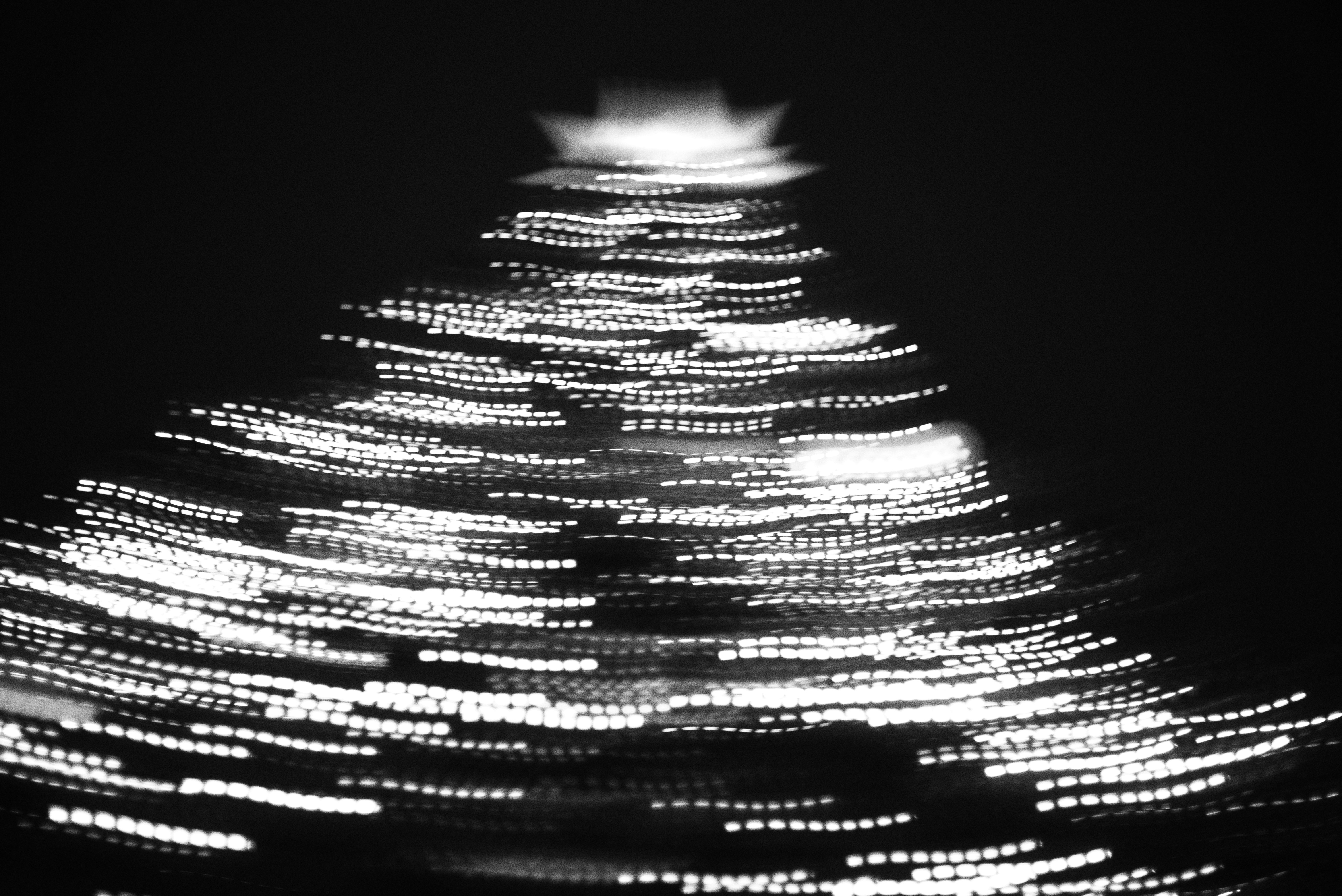 Monochrome Spiral of Holiday Lights: A Motion-Bloomed Christmas Tree