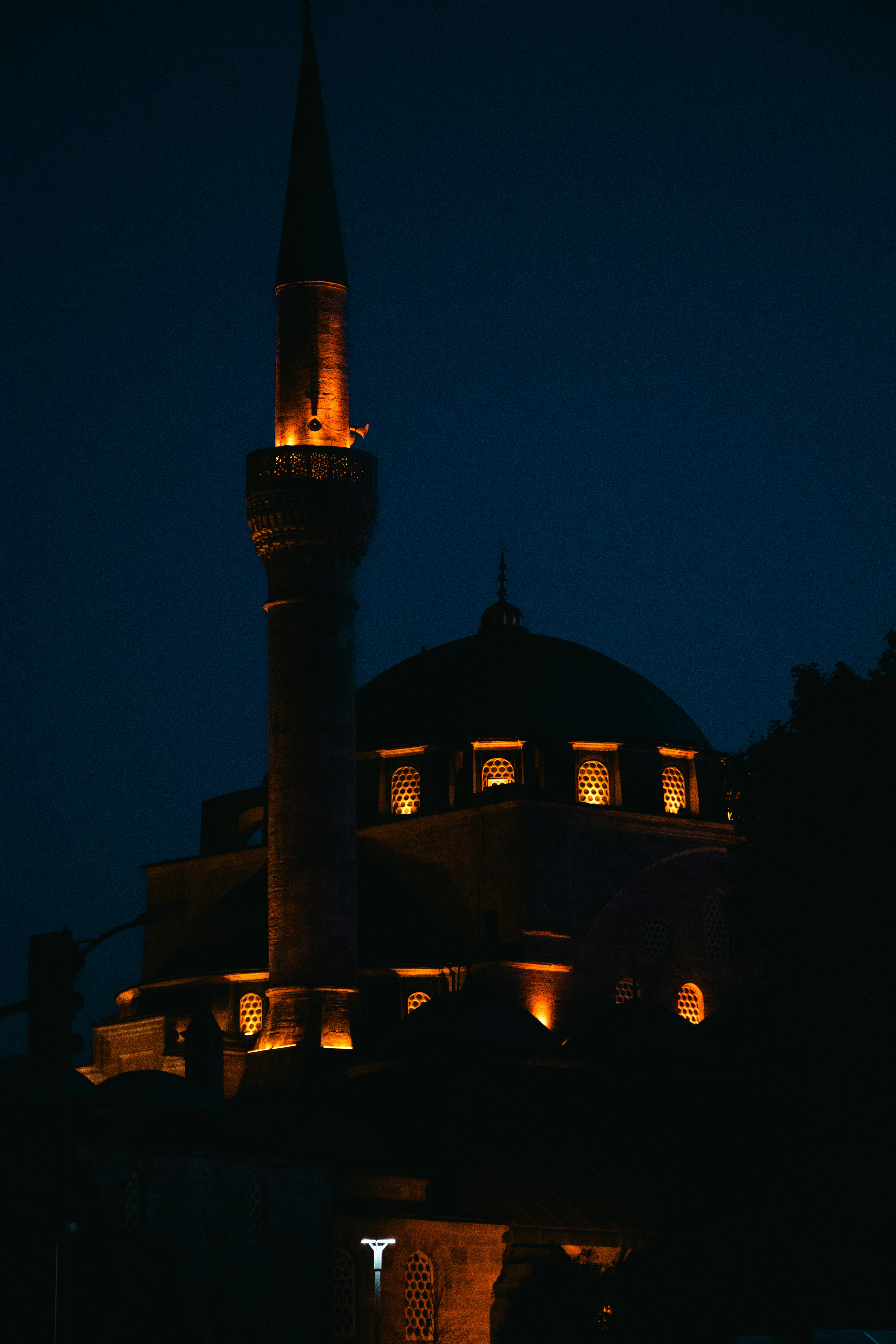 Amber Glow Over a Night Mosque: The Minaret in Focus