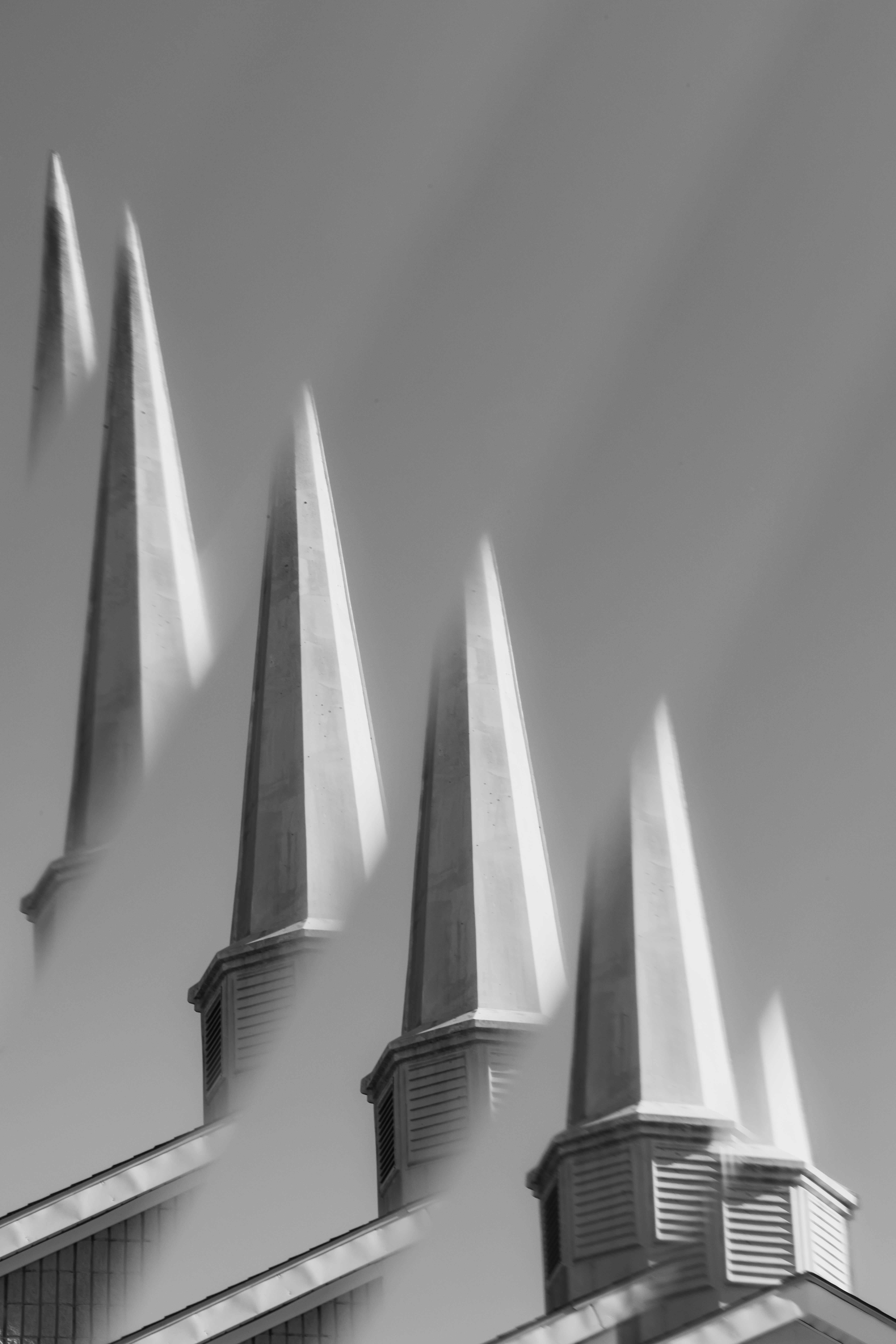 A black and white photo of a row of spires photo – Free City Image on ...