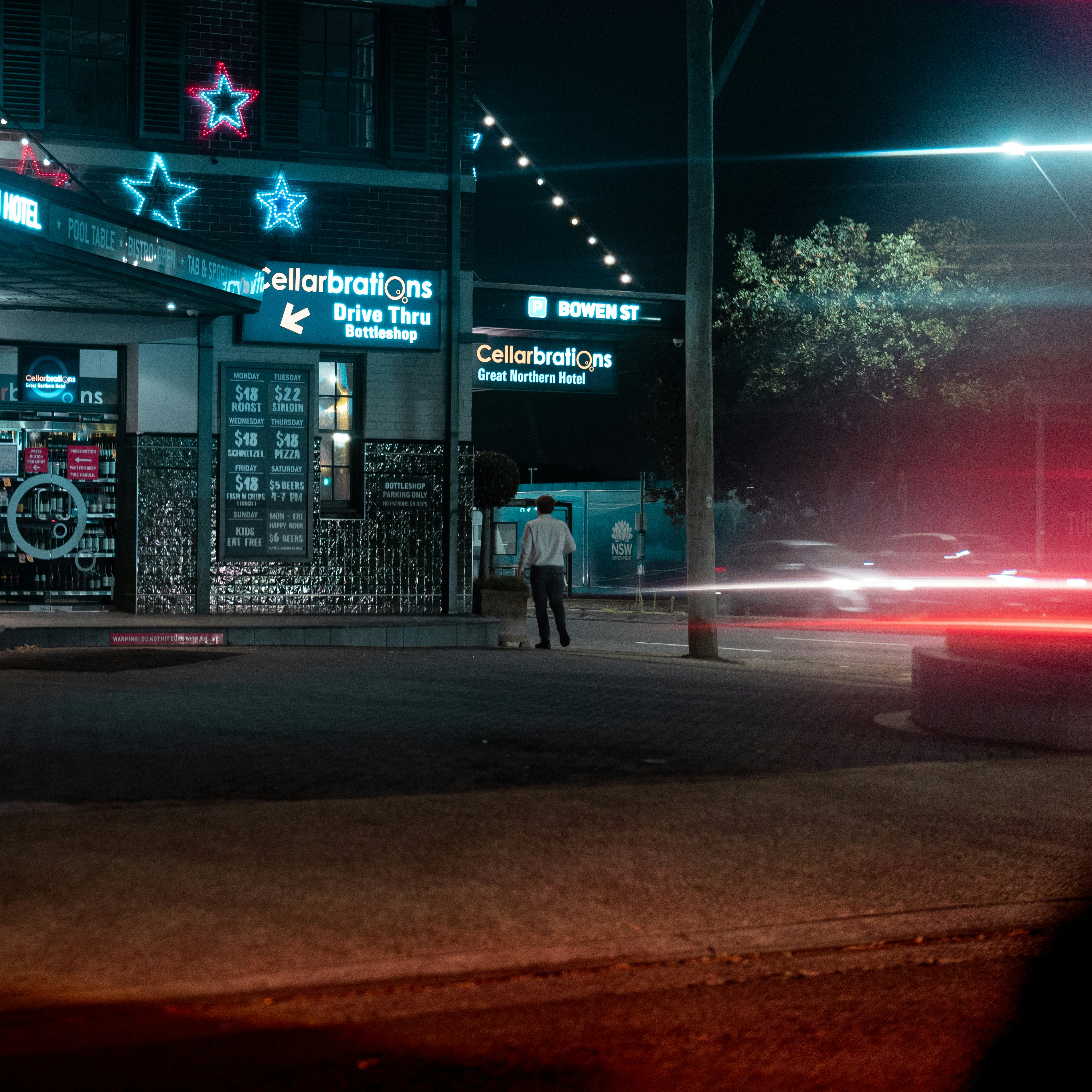 Night Street Pulse: Neon Stars and a Lonely Pedestrian