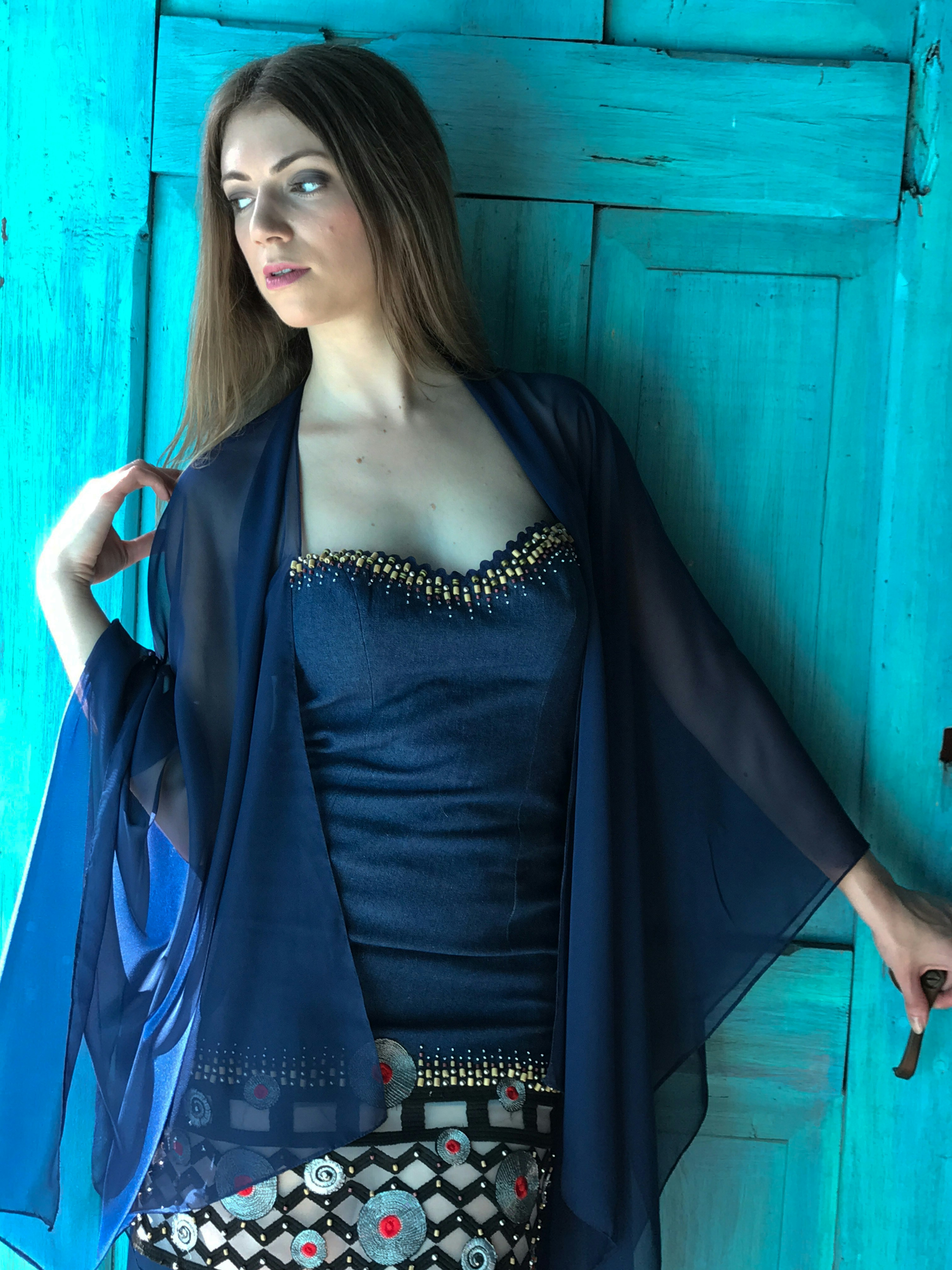 Cobalt Silk and Beaded Trim Before a Turquoise Door