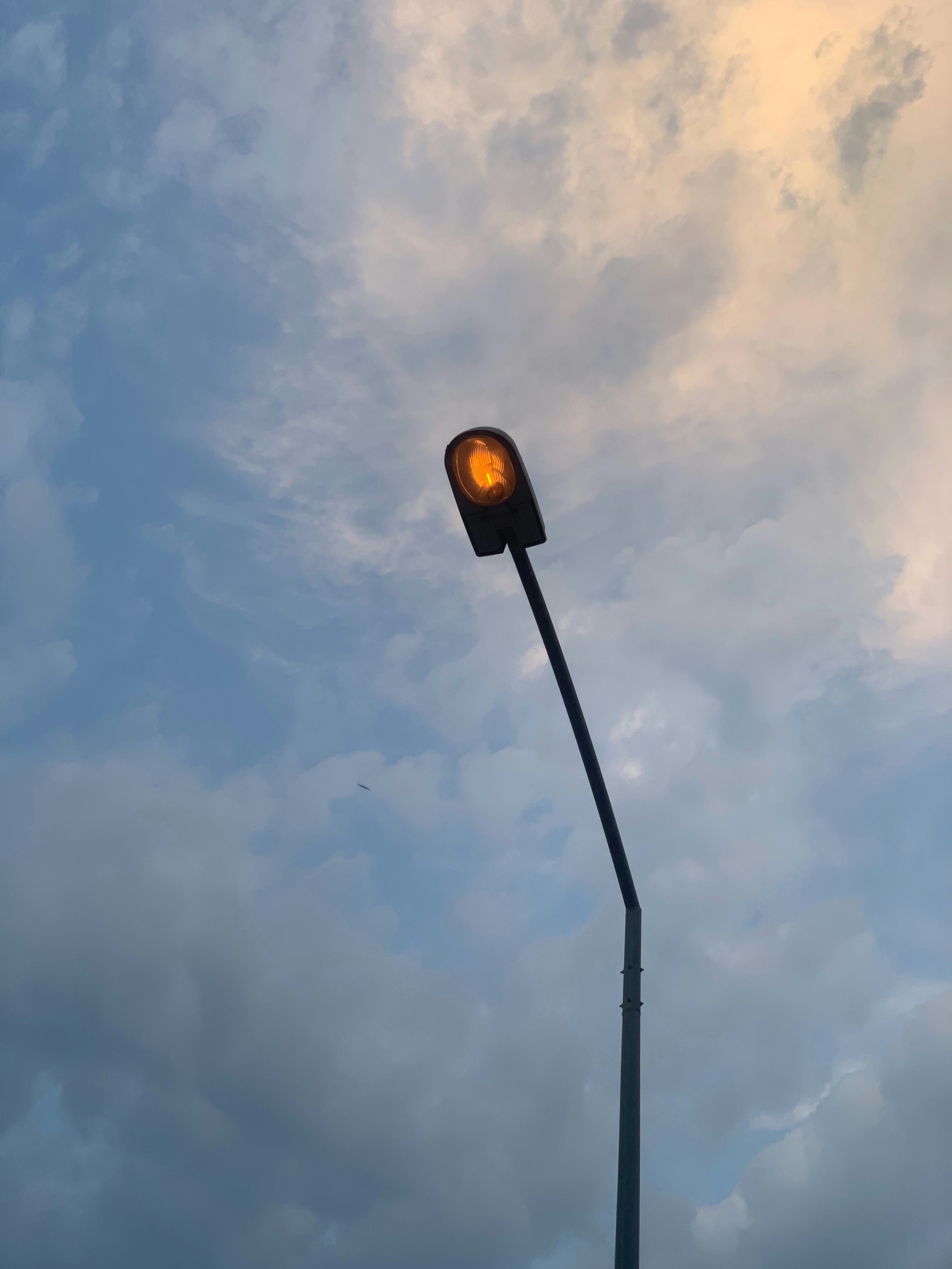 Amber Lantern Above a Quiet Sky