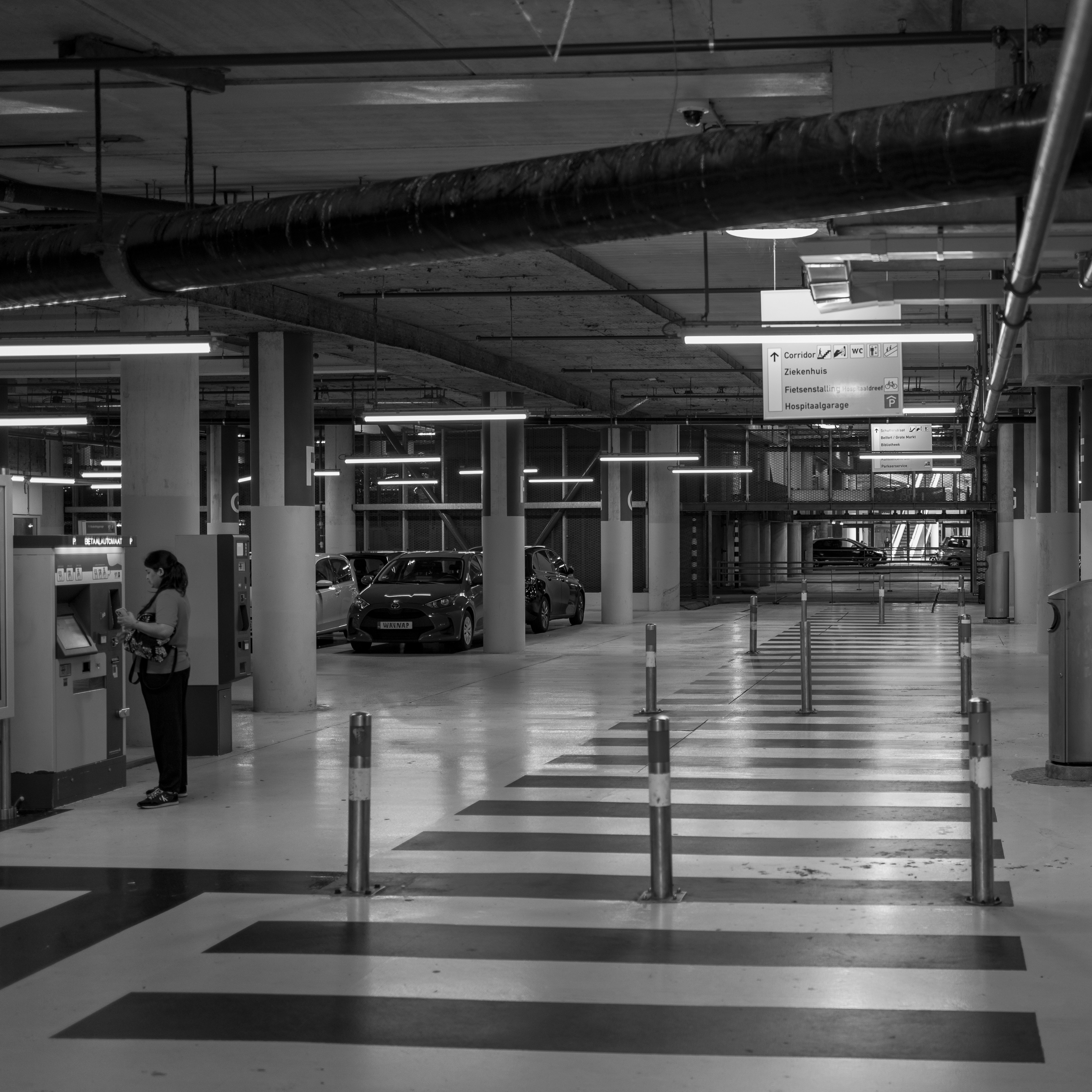 Quiet Moment at the Ticket Booth in a Dim Underground Parking Garage