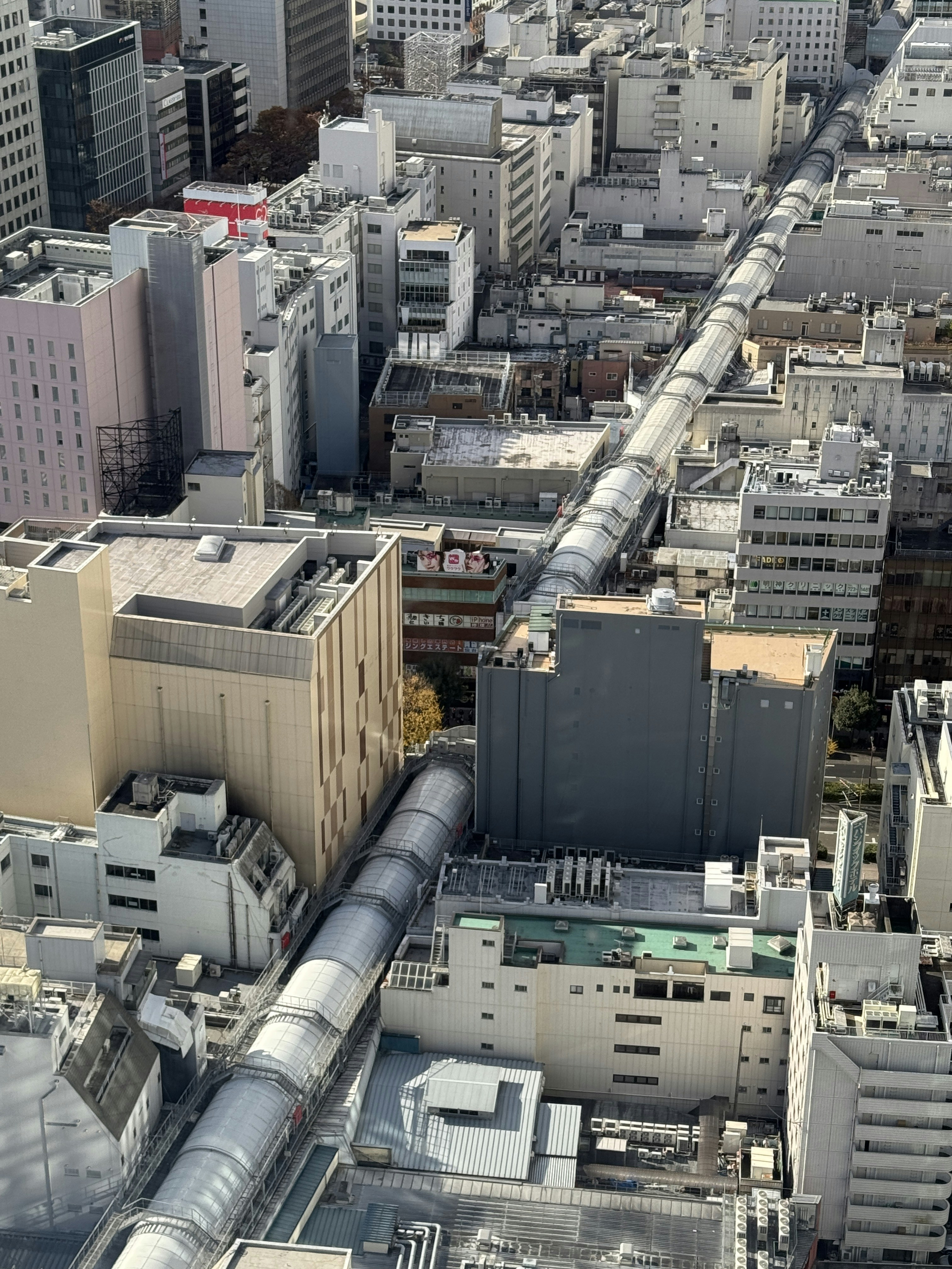 An aerial view of a city with tall buildings photo – Free Sendai Image ...