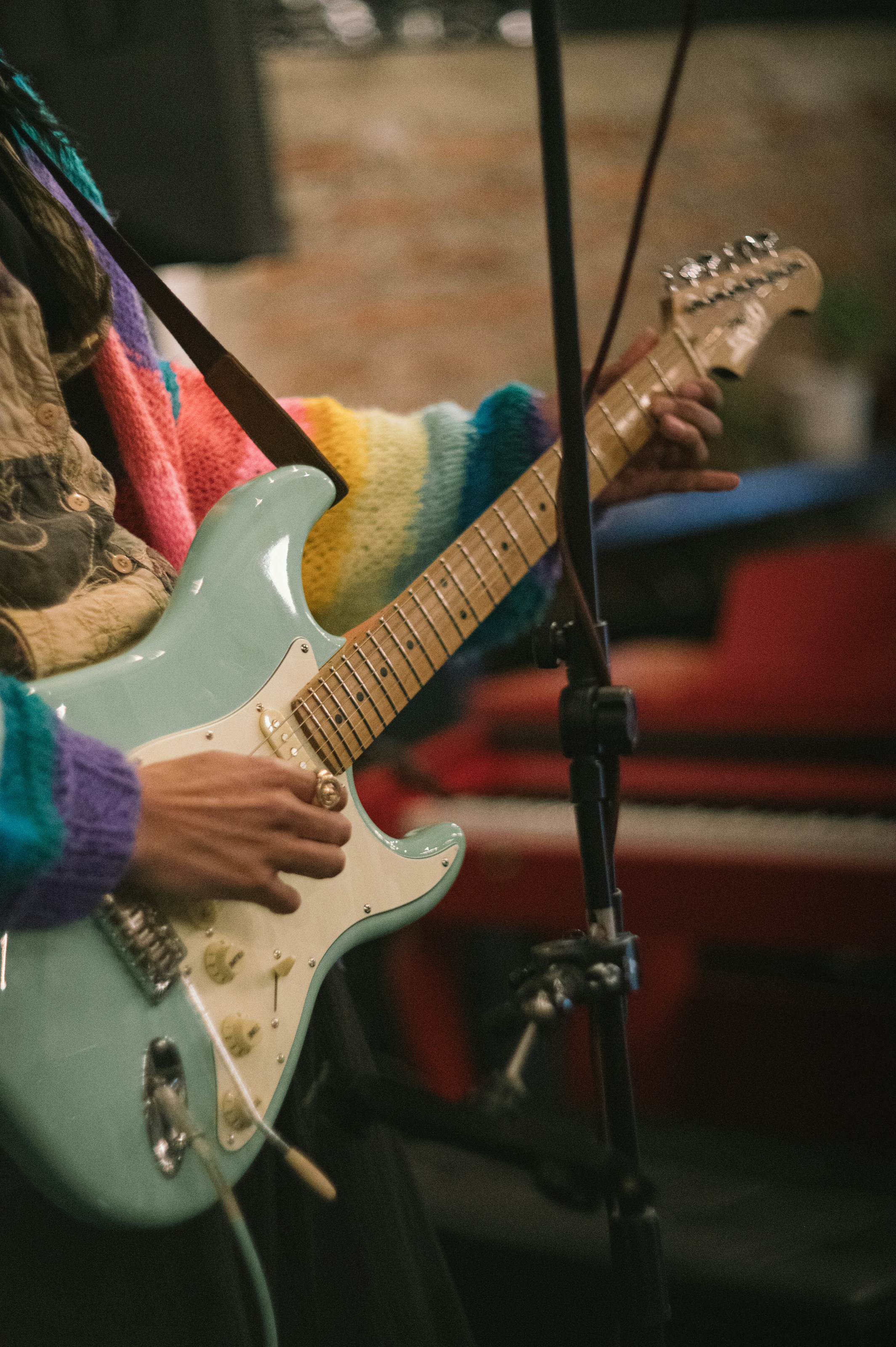 Mint Guitar Glow: A Velvet-Toned Performance in Soft Focus