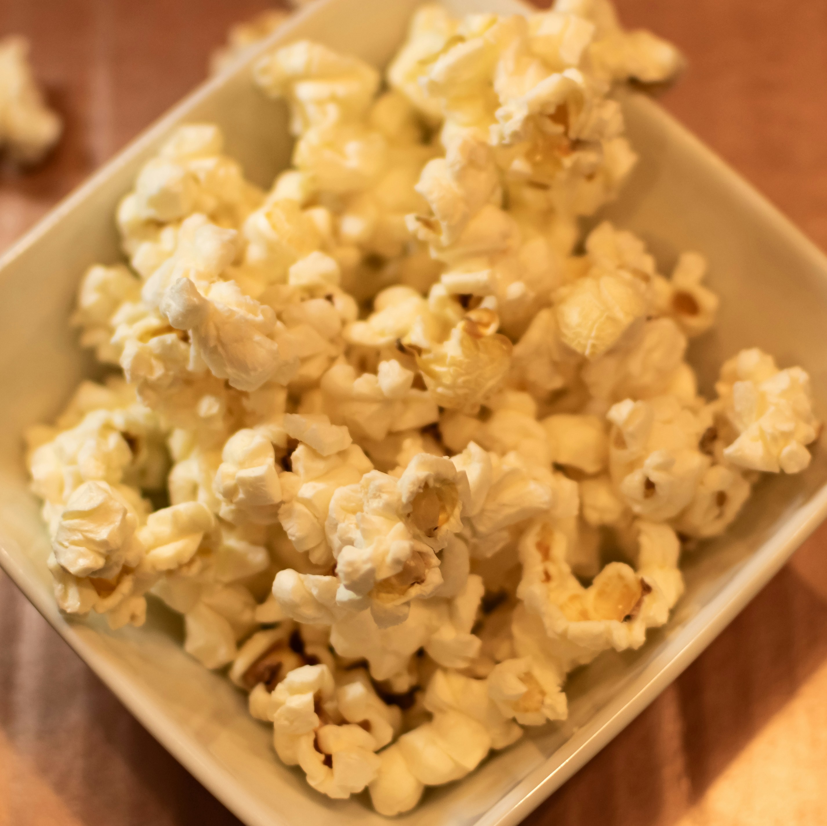 Amber-lit Popcorn Cloud in a White Ceramic Bowl