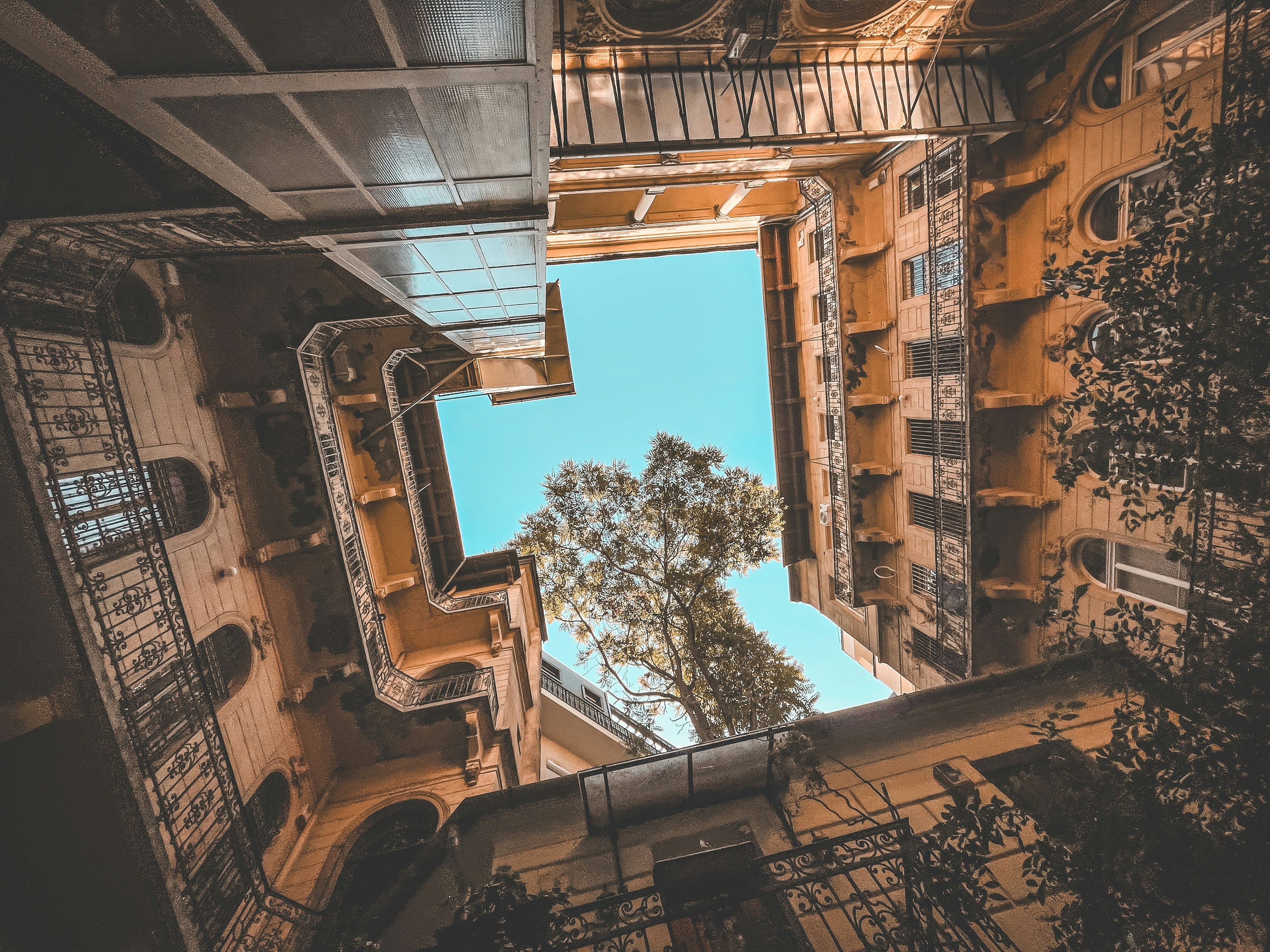 An aerial view of a building looking up into the sky photo – Free ...