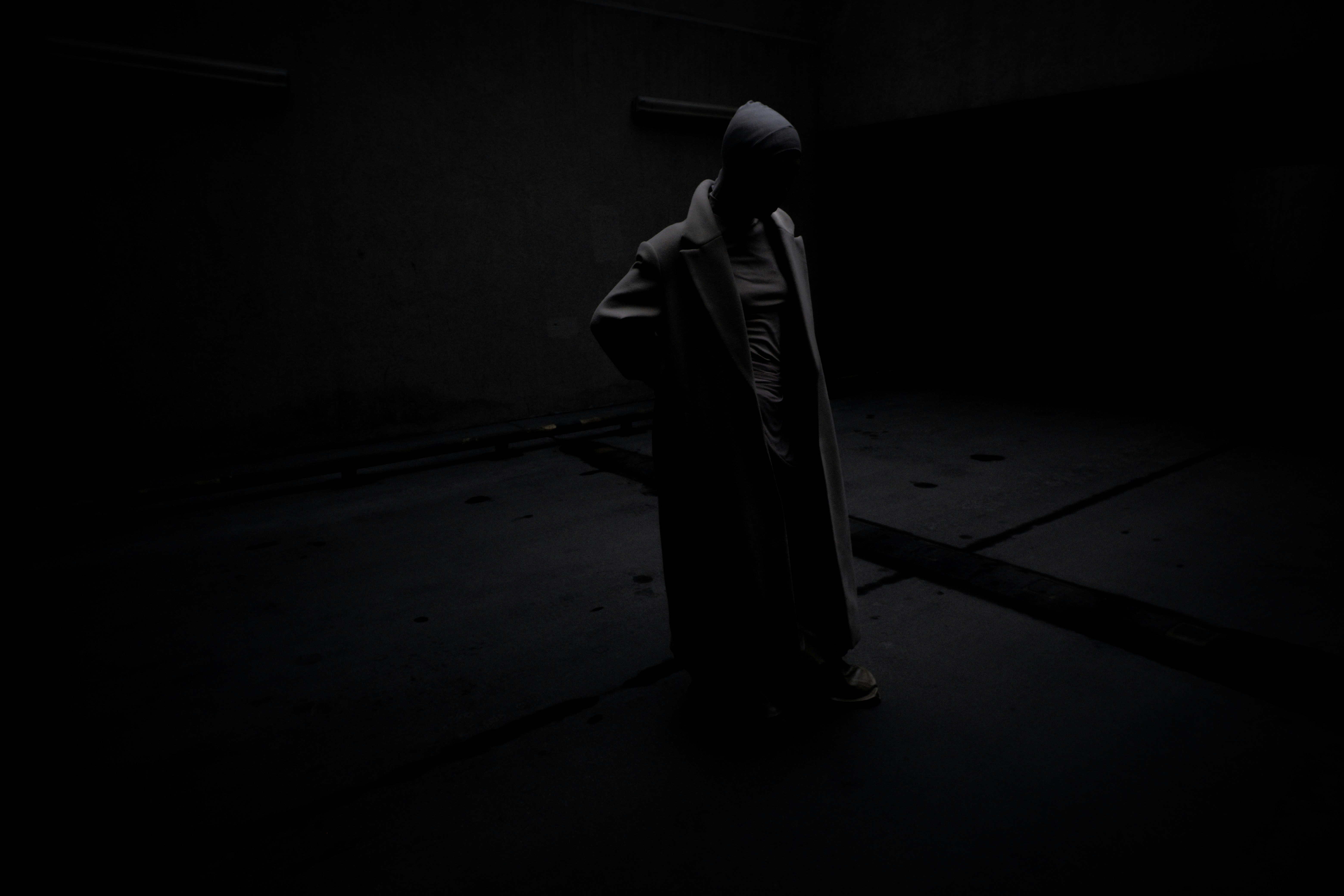 A person standing in the dark alone photo – Free Woman Image on Unsplash