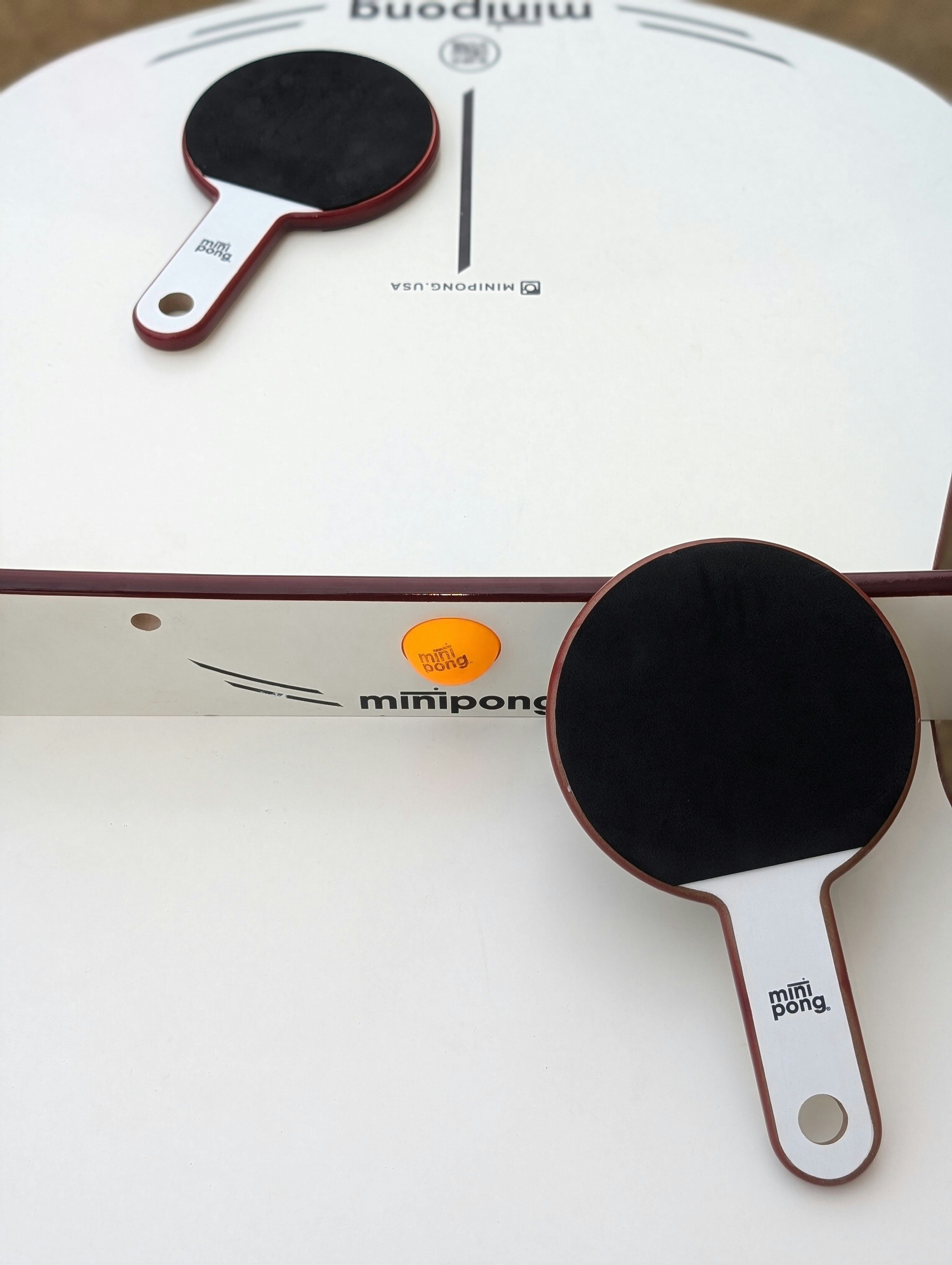 Table Tennis Duo: Minimalist Gameplay on a White Surface