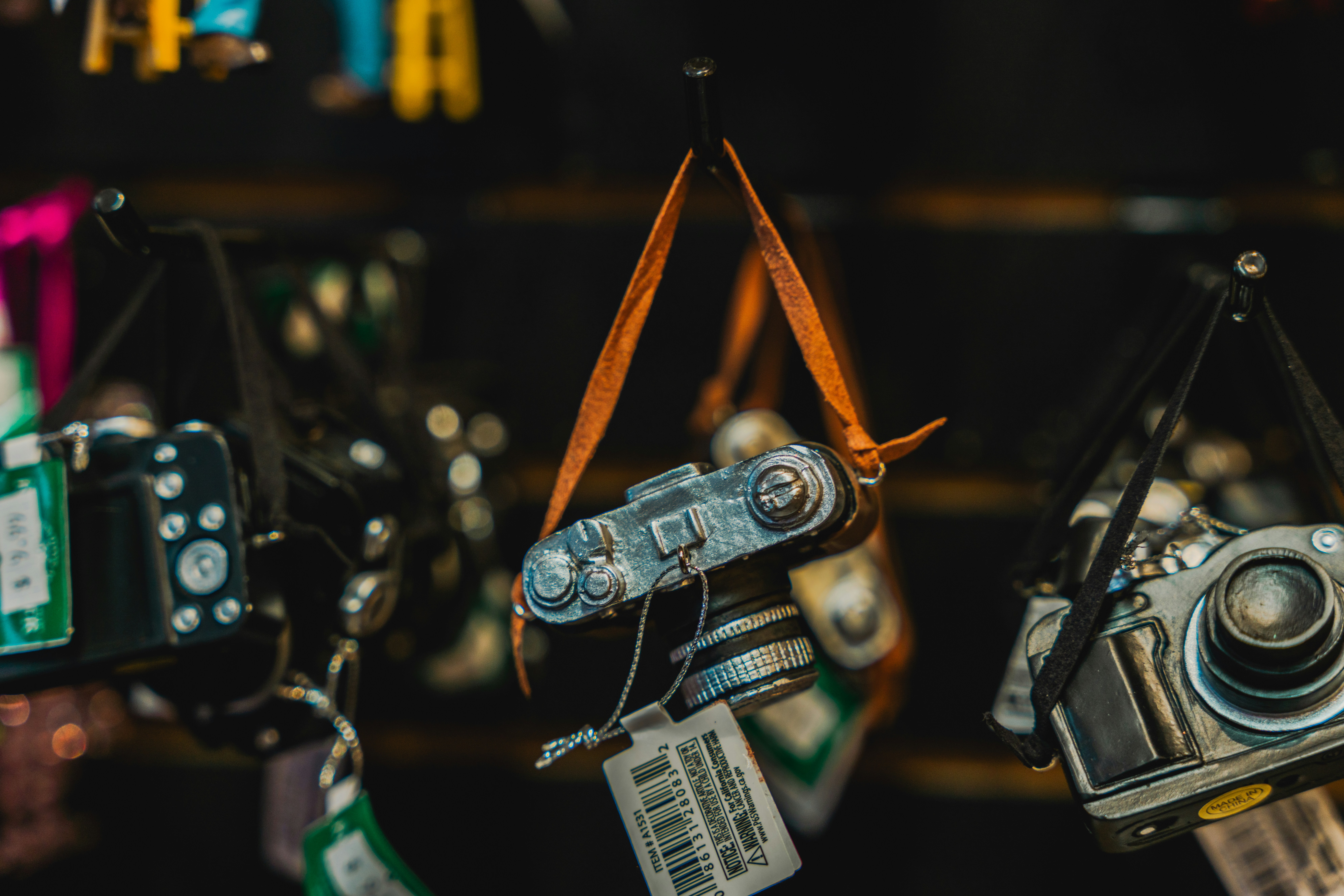 A group of cameras hanging on a wall photo – Free Electronics Image on ...