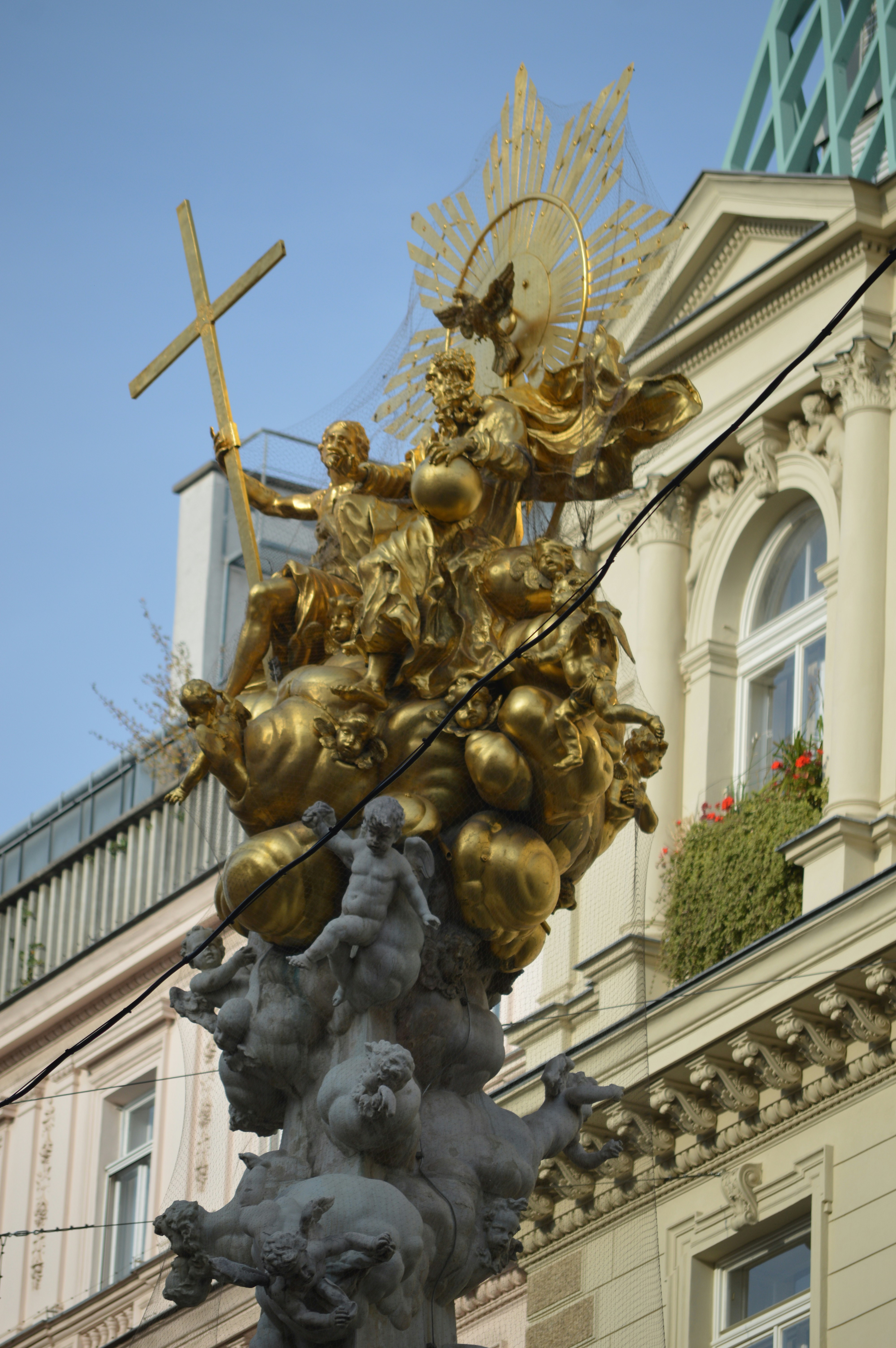 Gilded Ascension: Sunburst Triumph Over a City Façade