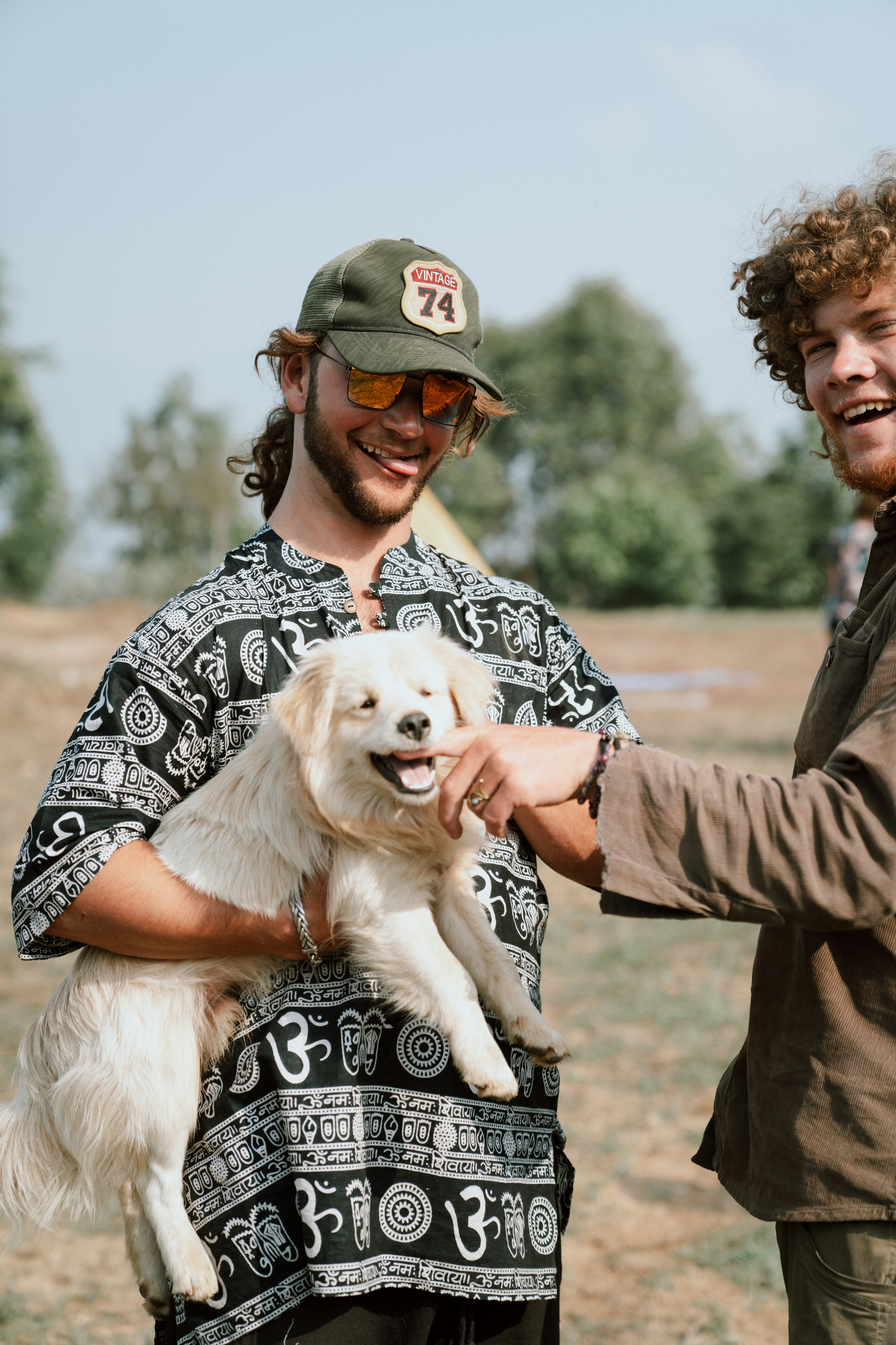 Sunlit smile: friends with a fluffy companion