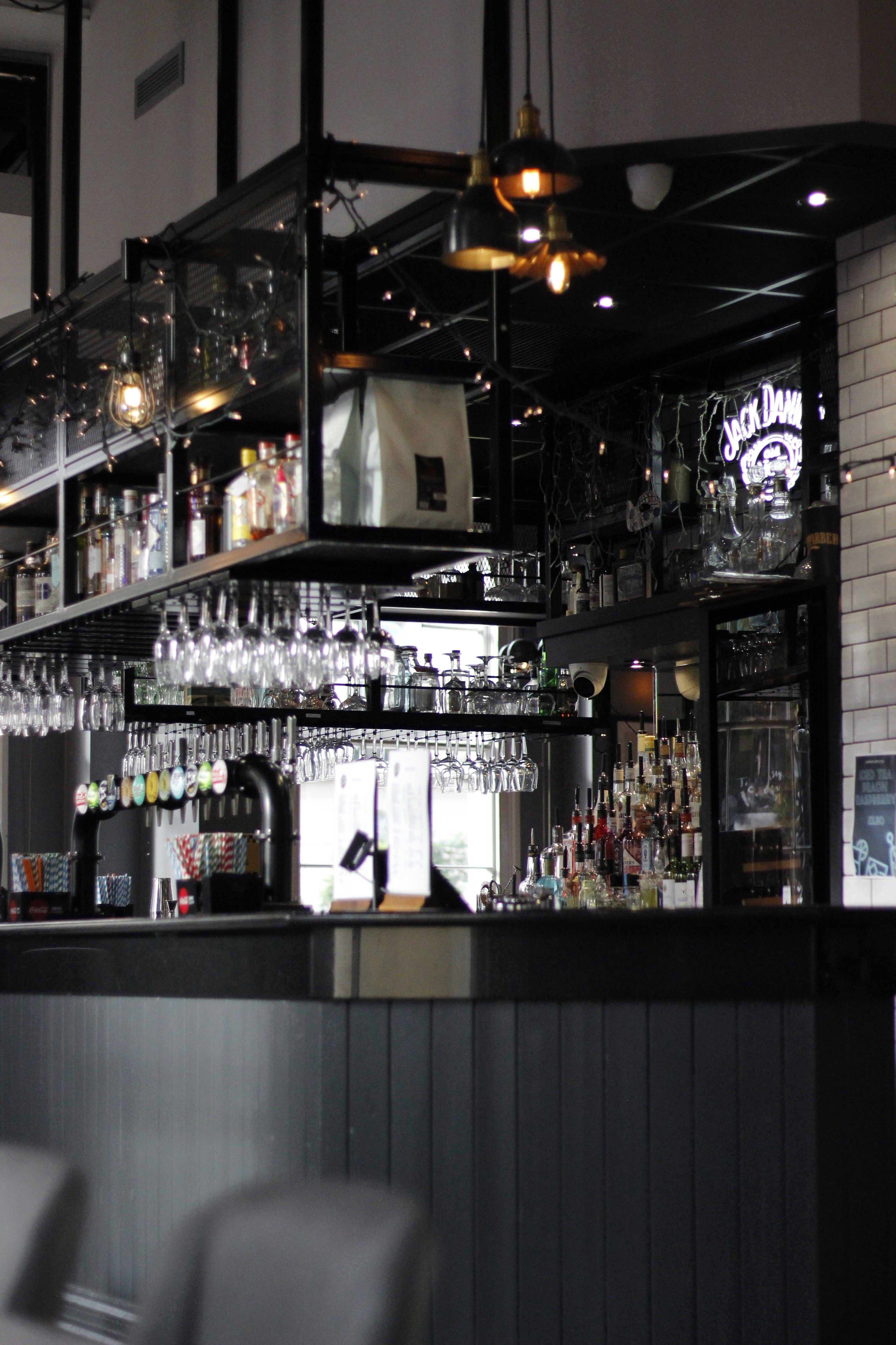 A bar with a bunch of bottles on it photo – Free London Image on Unsplash