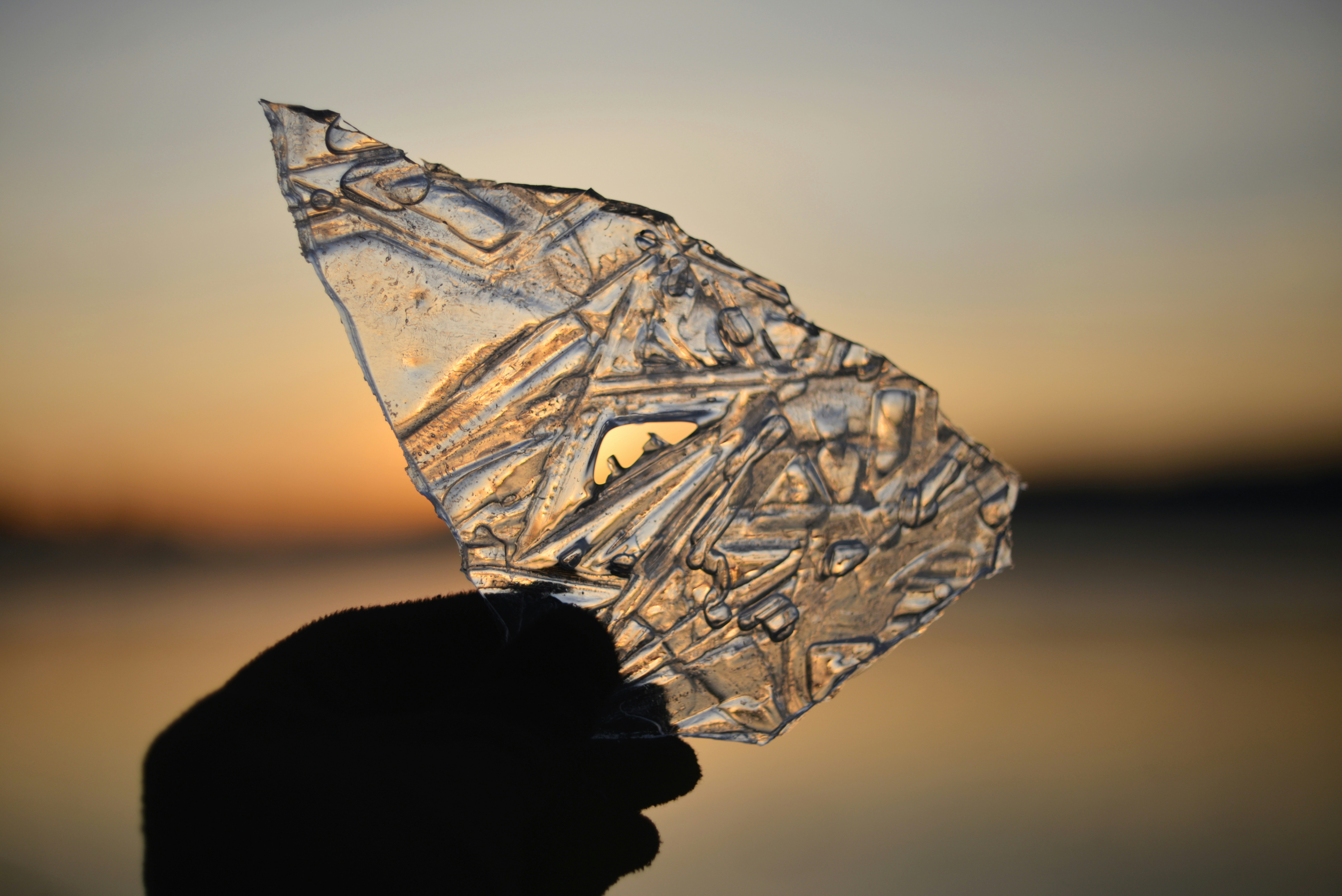 Sunset Crystalline: a hand-held ice shard catching the last light