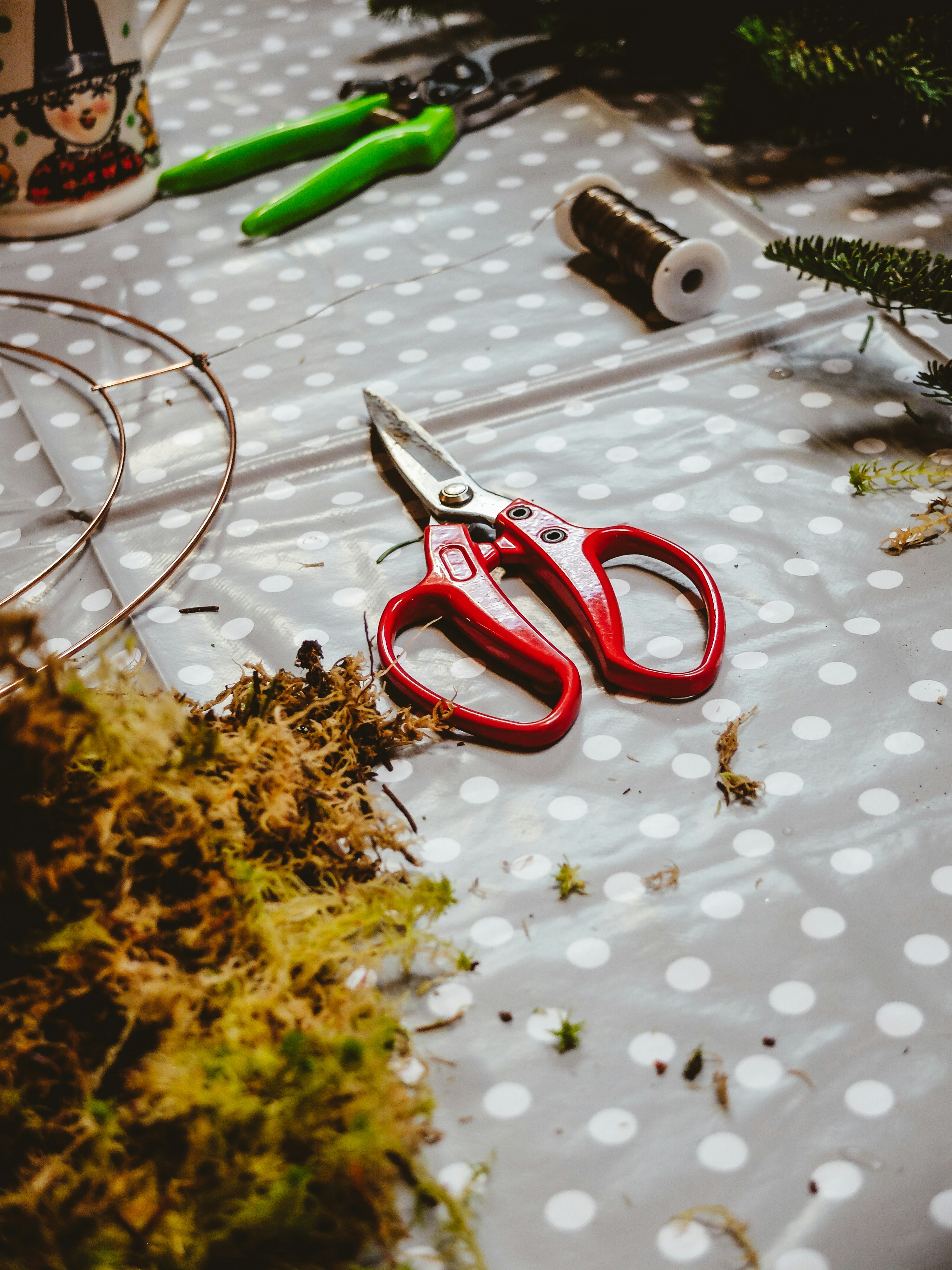 Red-handled Shears on a Dotted Worktable: A Seasonal Craft Scene
