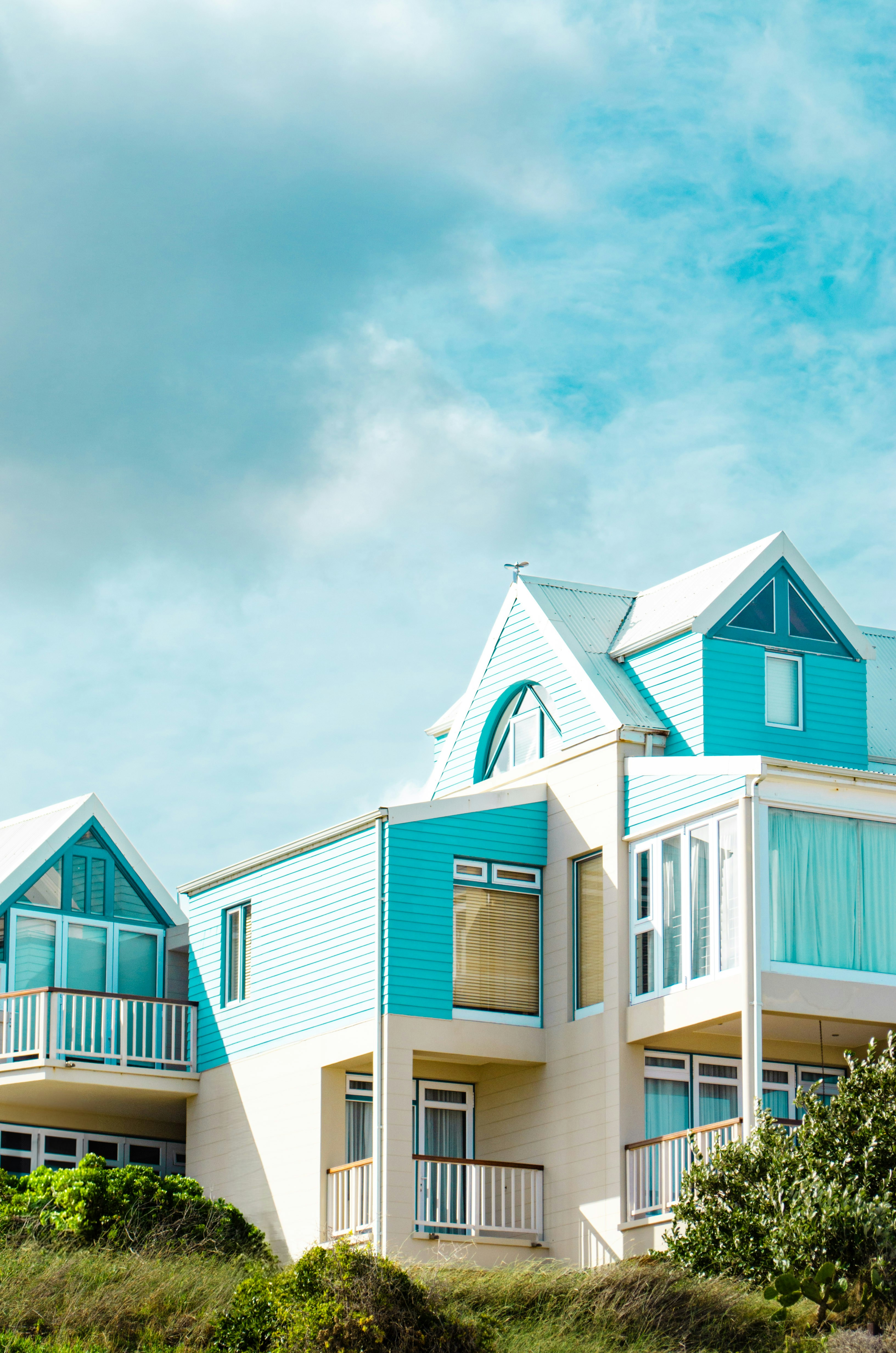Teal-Trim Oasis by the Sea: A Modern Coastal Villa Under a Wide Blue Sky