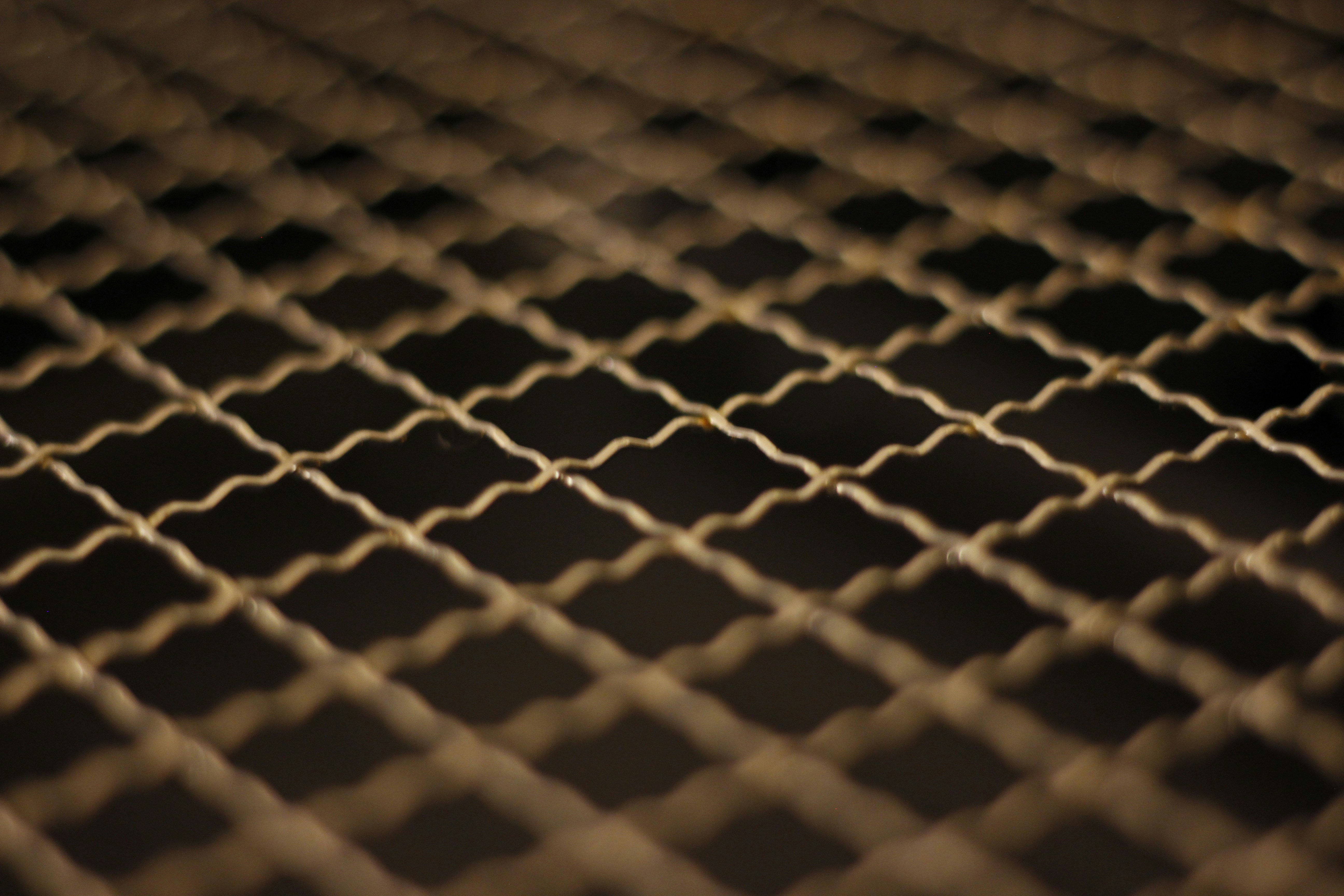 A close up view of a metal grate photo – Free Steel wire Image on Unsplash