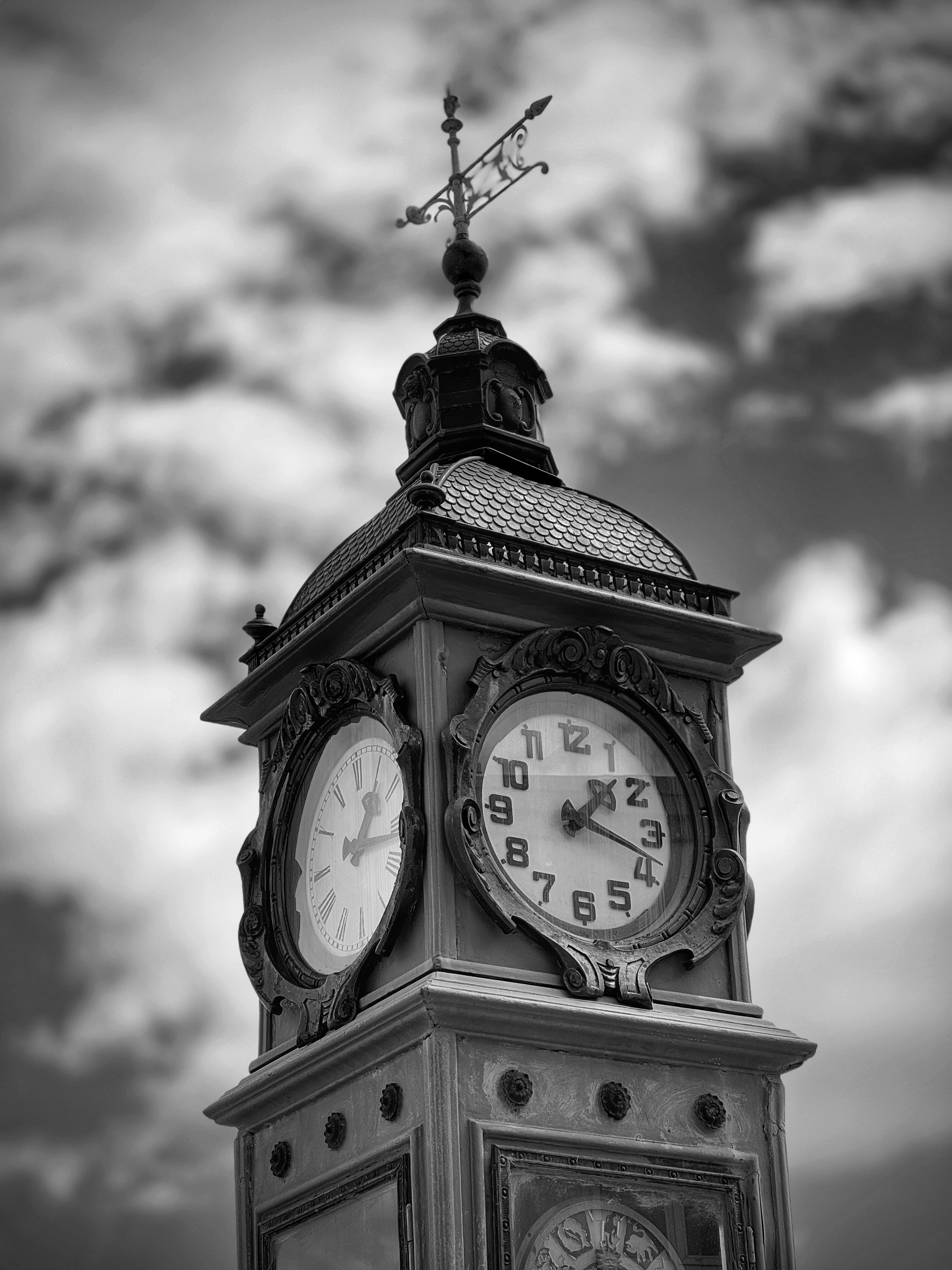 Clock | A black and white photo of a clock tower