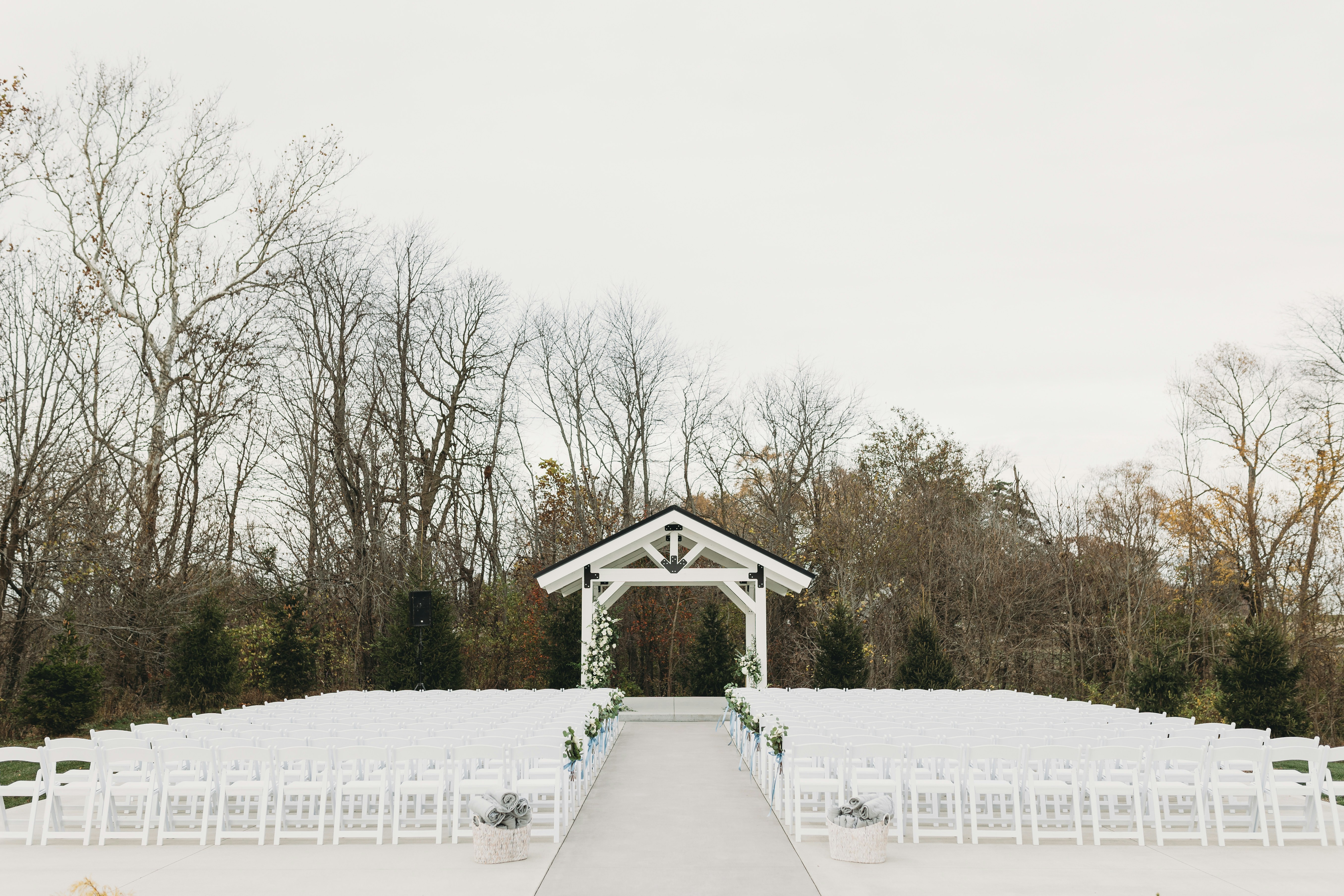 A white wedding set up with white chairs photo – Free The sixpence ...