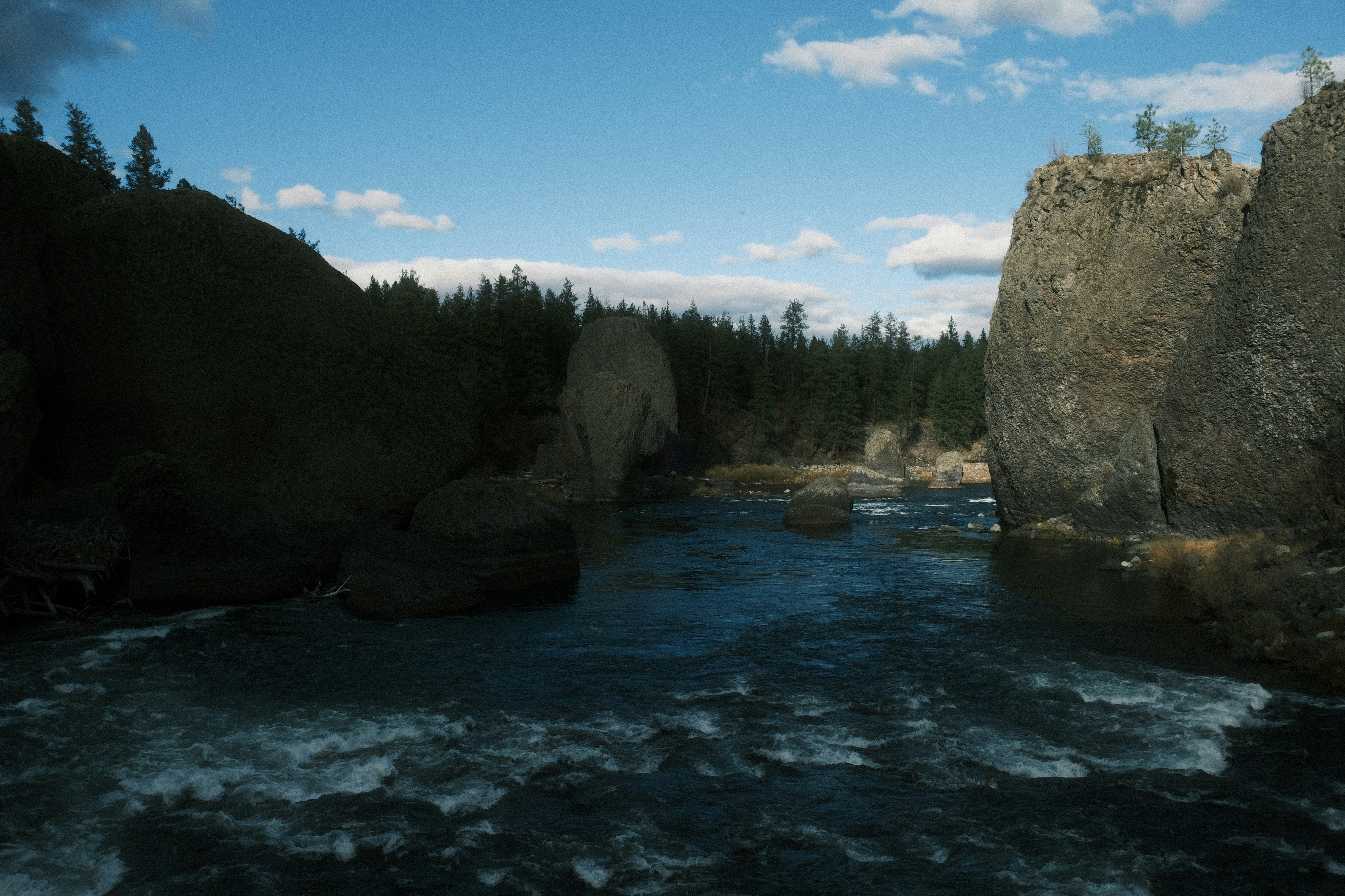 A river flowing between two large rocks photo – Free Riverside state ...