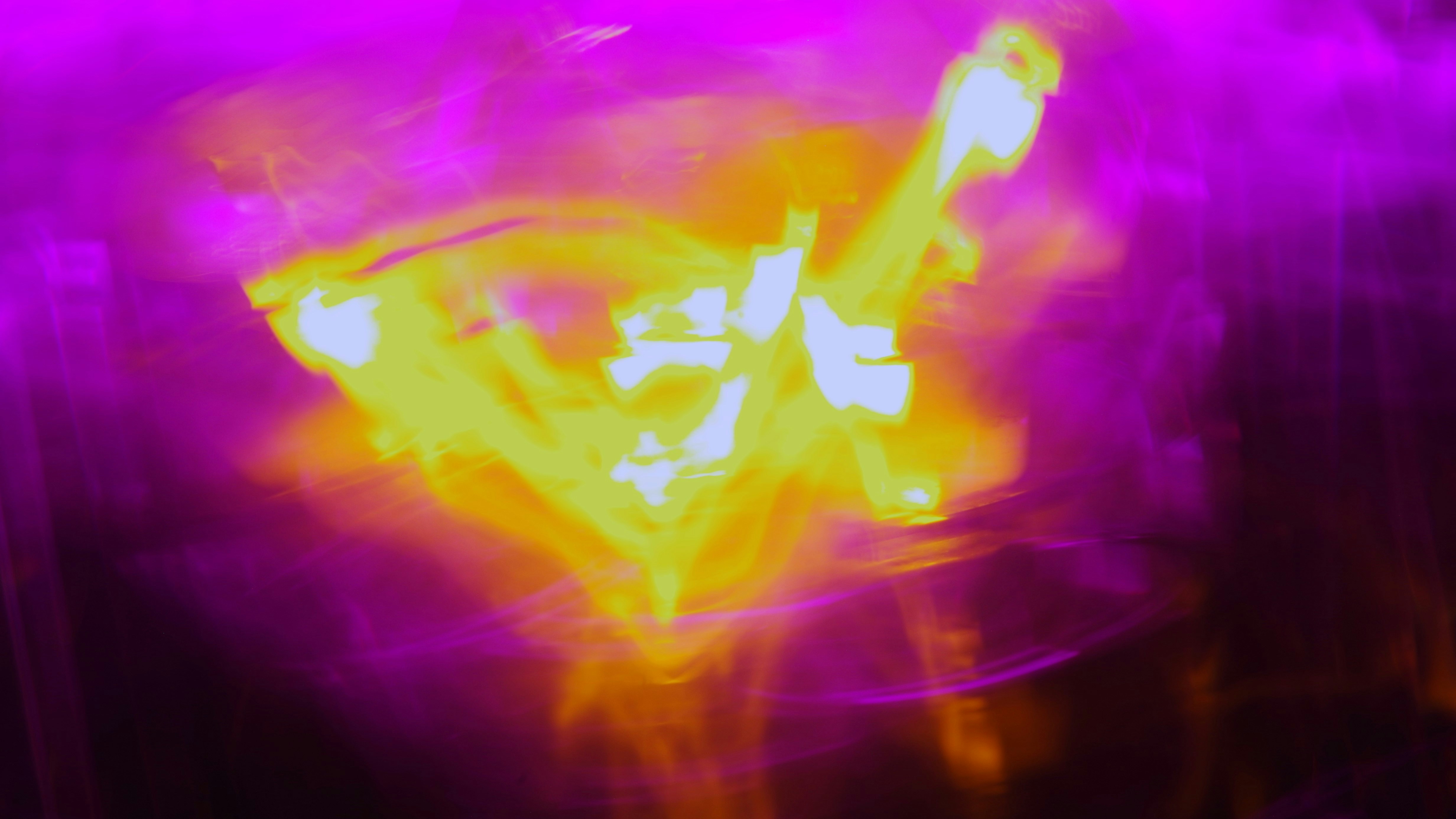 A blurry image of a yellow and purple object photo – Free Light Image ...