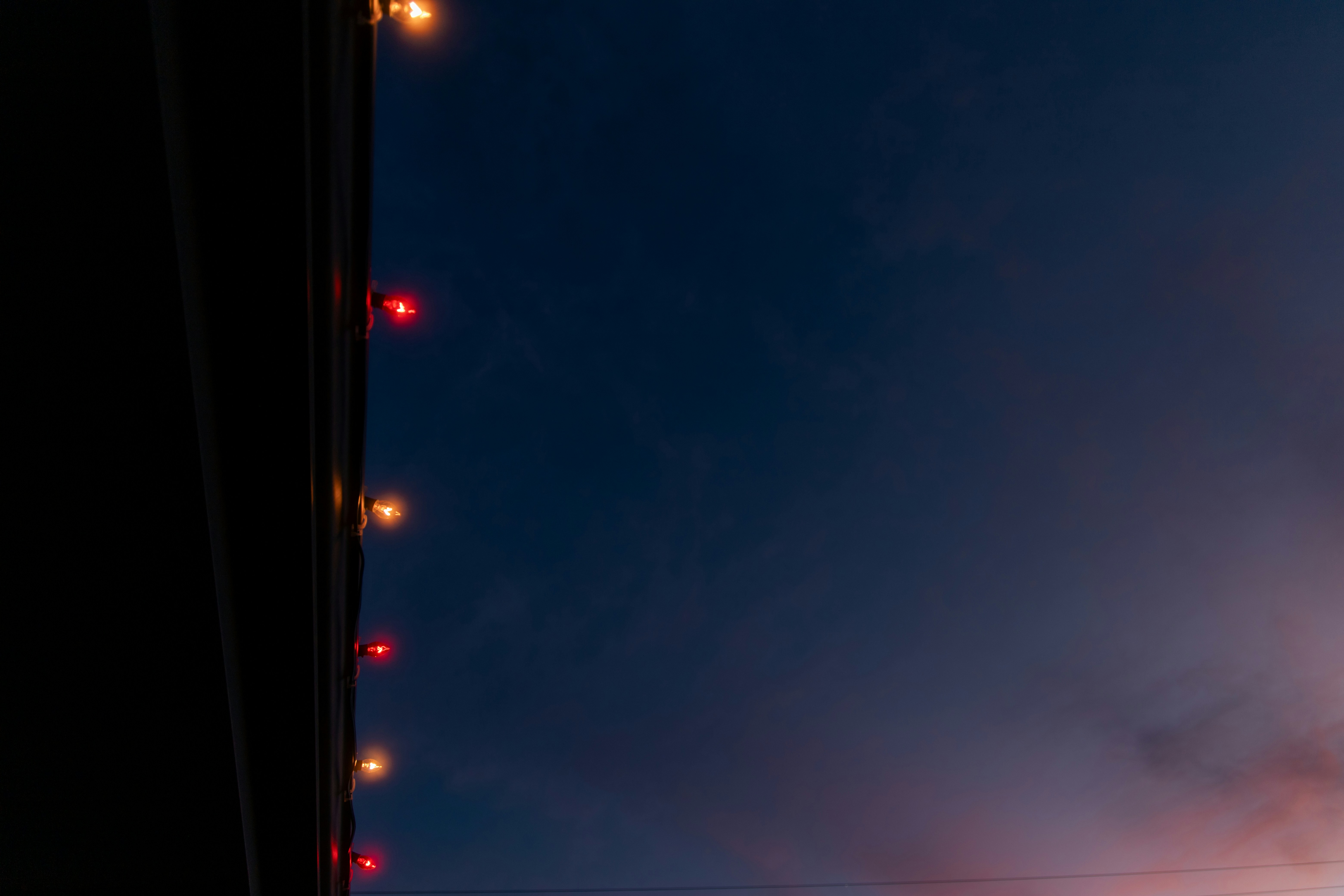 A traffic light is lit up in the night sky photo – Free Moon Image on ...