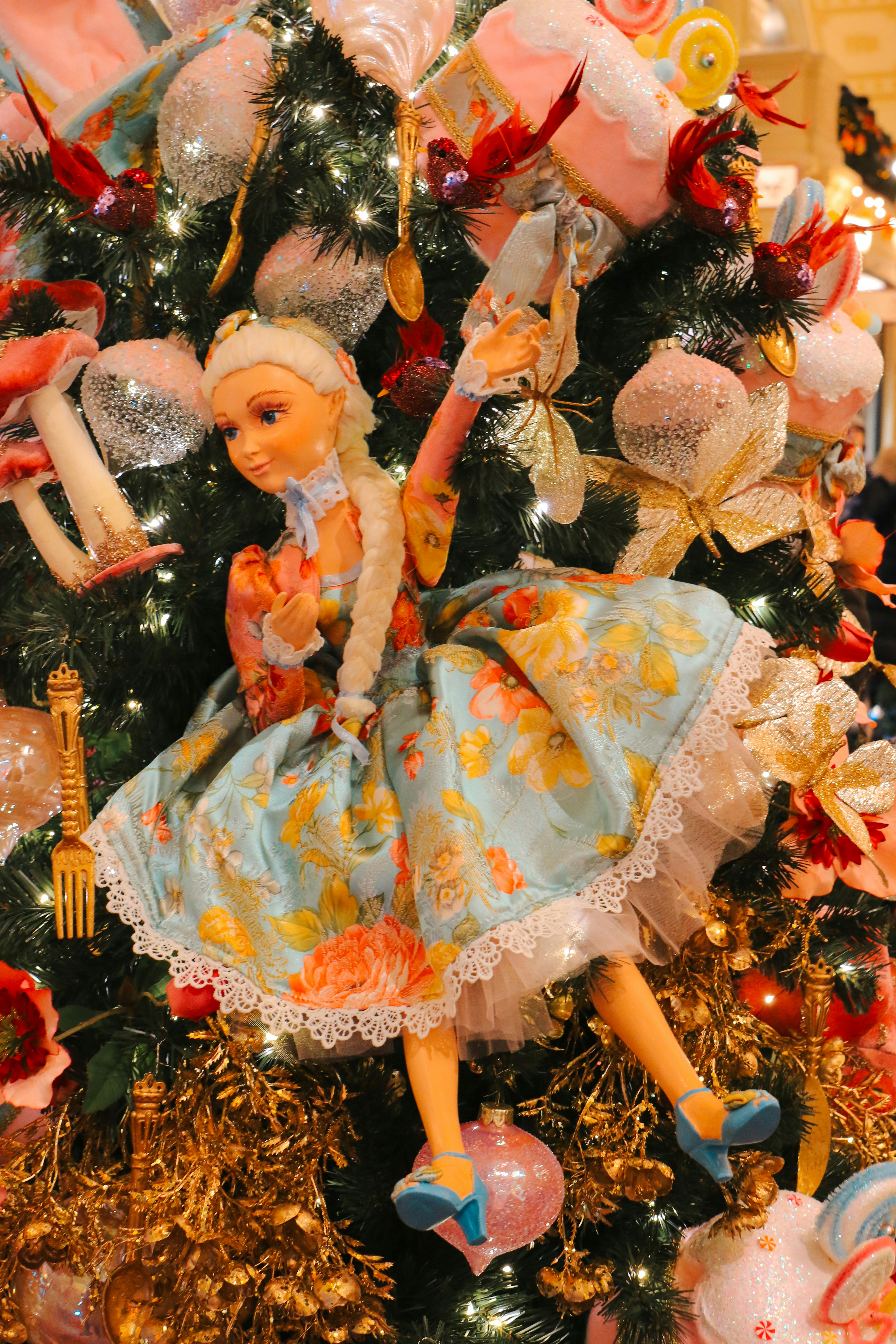 A christmas tree with a doll on top of it photo – Free Christmas Image ...